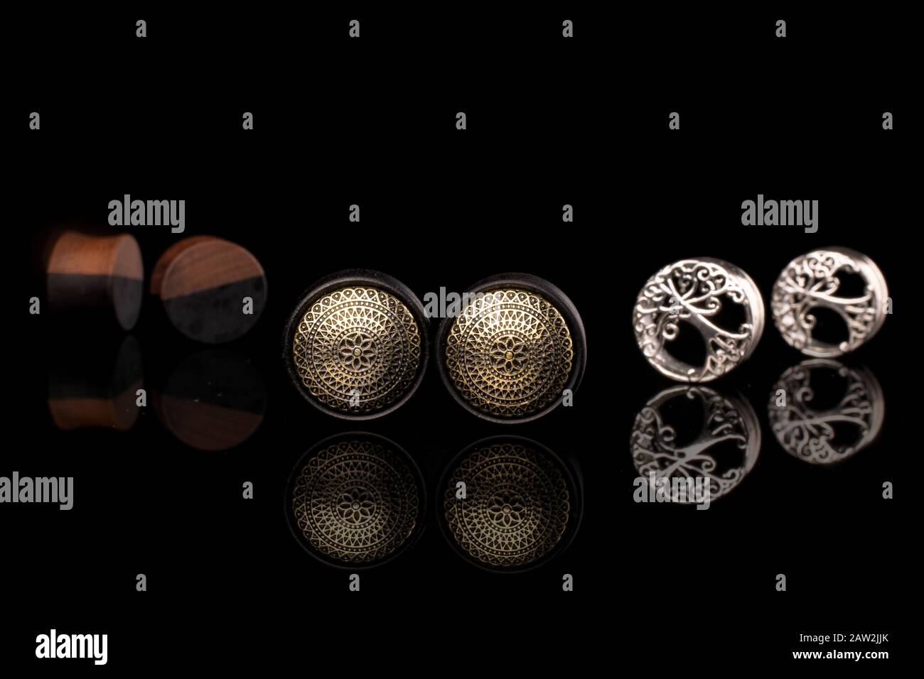 Group of six whole plug isolated on black glass Stock Photo - Alamy