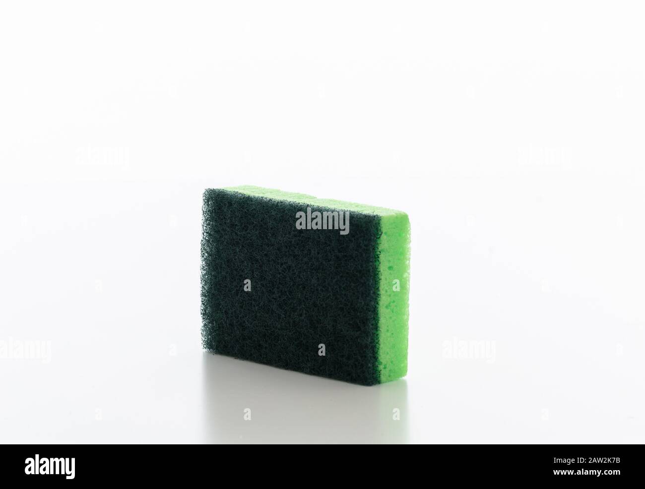 Cleaning kitchen sponge isolated against white background. Green color ...