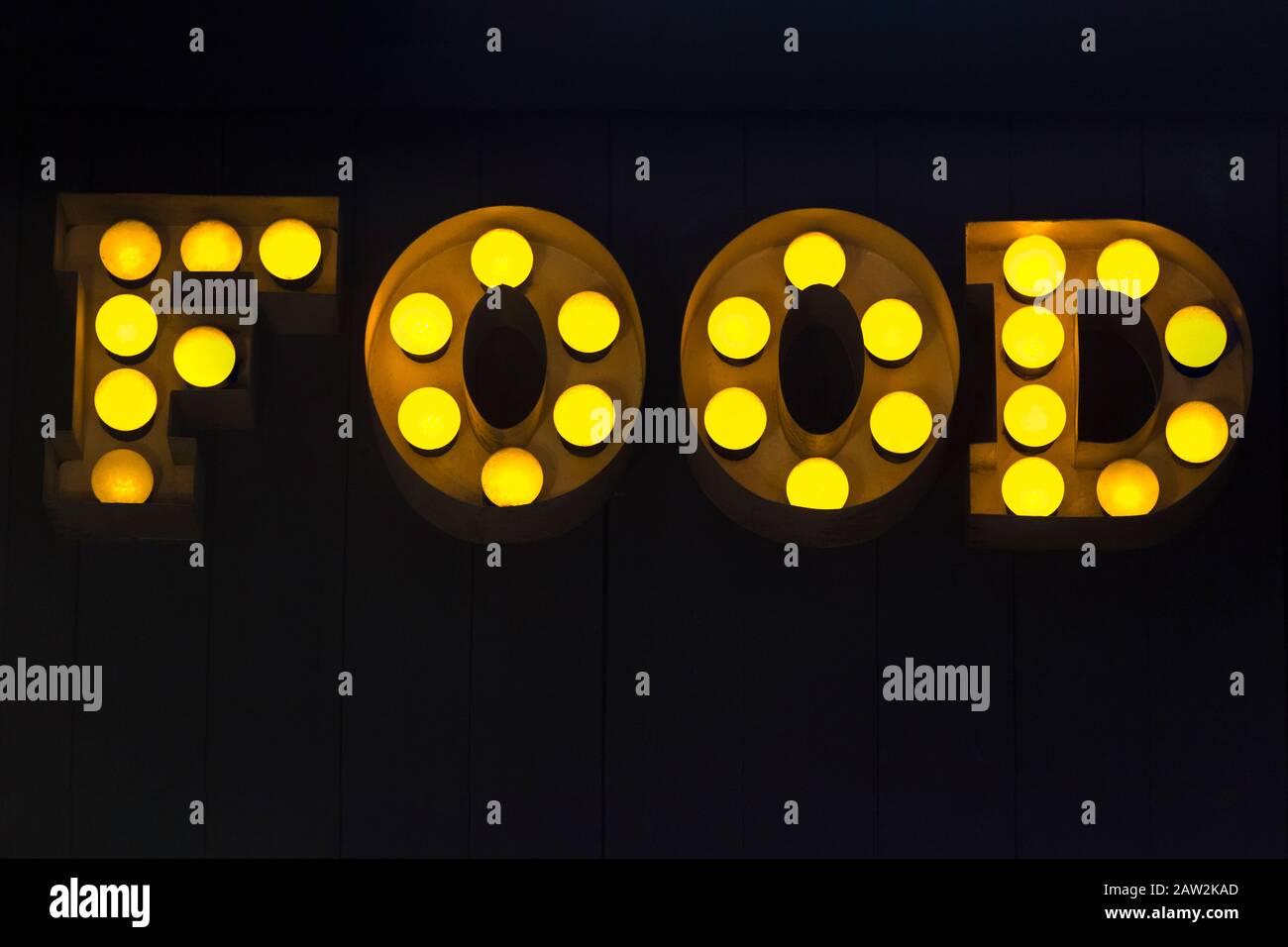An old-fashioned "Food" sign with yellow lightbulbs Stock Photo - Alamy