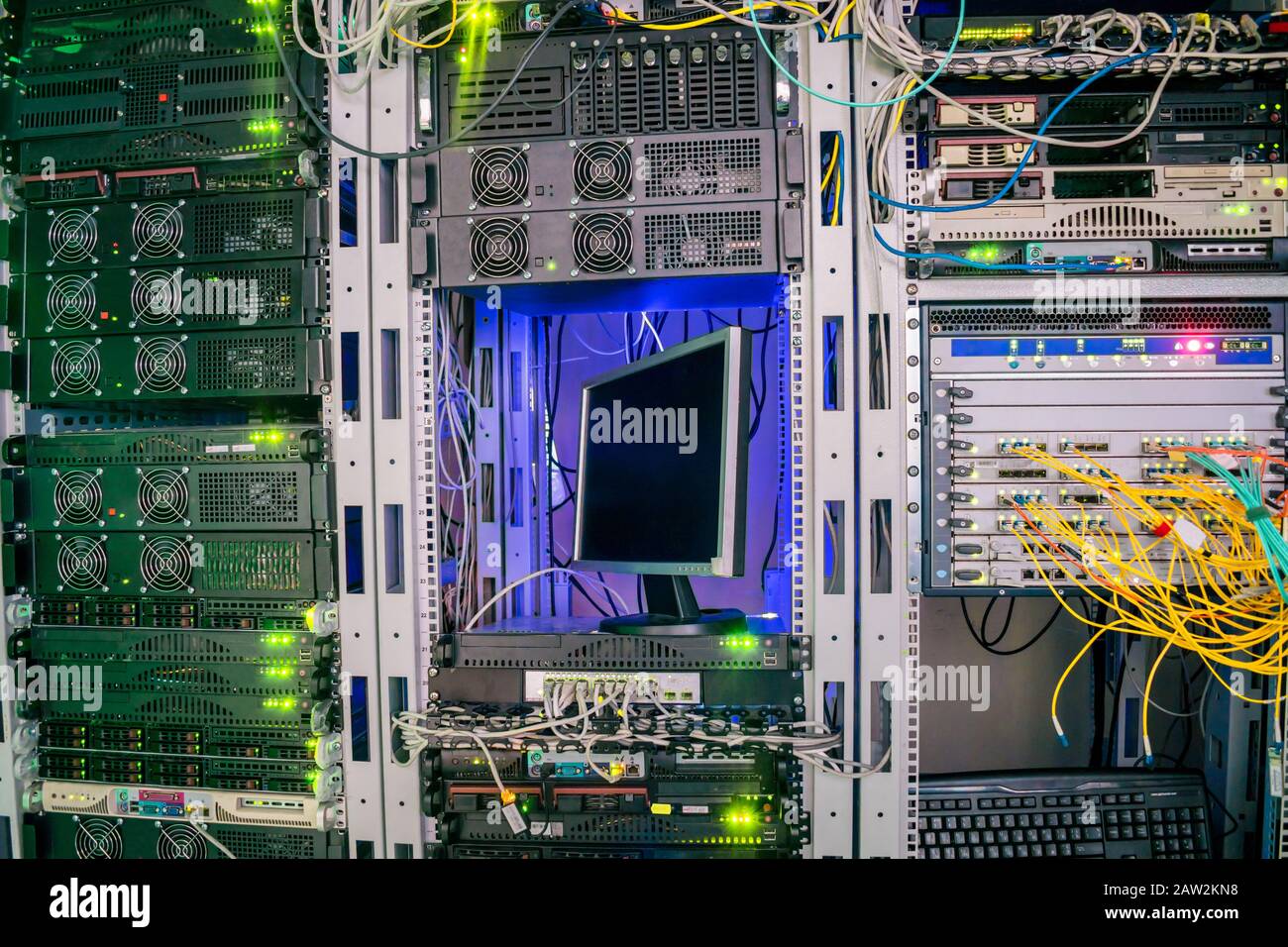 The server rack is in a modern data center. The monitor is installed in ...