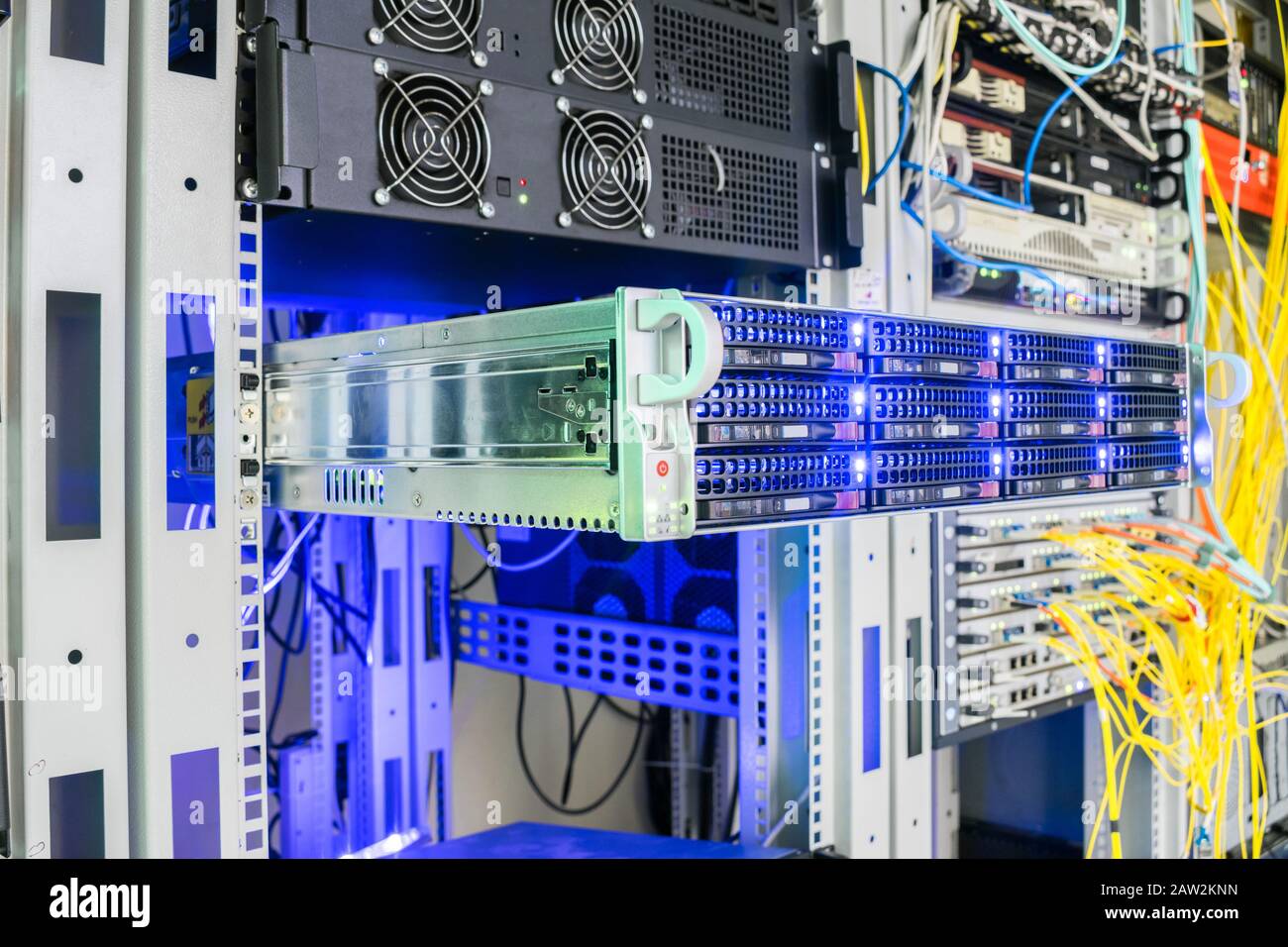 The database server on the skid is placed in the data center rack ...