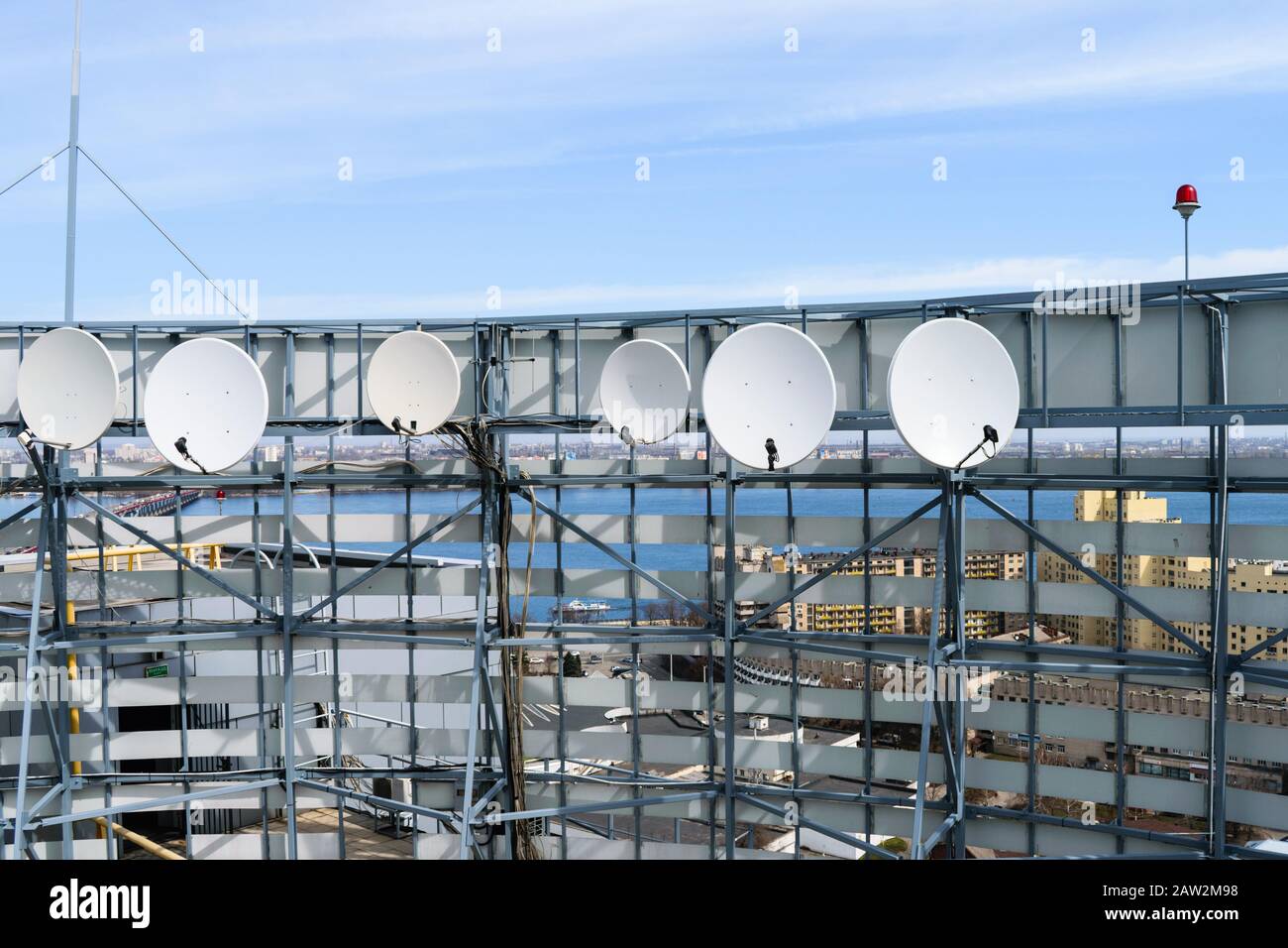 Satellite dishes are on the roof of the building. Television Center ...