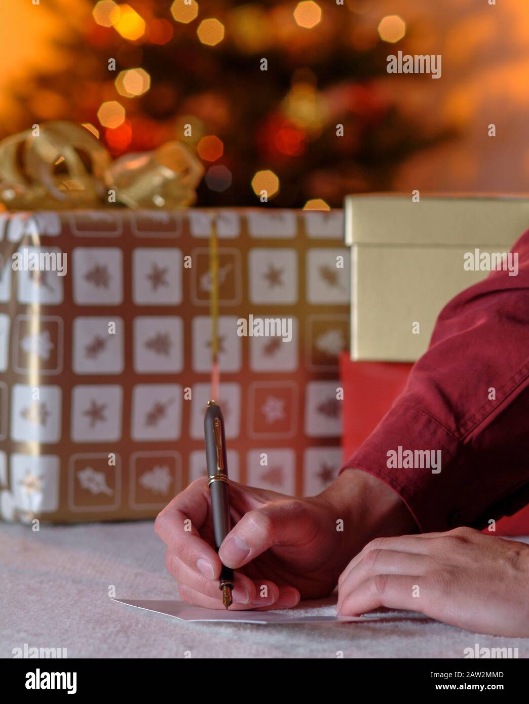 Writing a Christmas list or card with presents and Christmas tree in ...