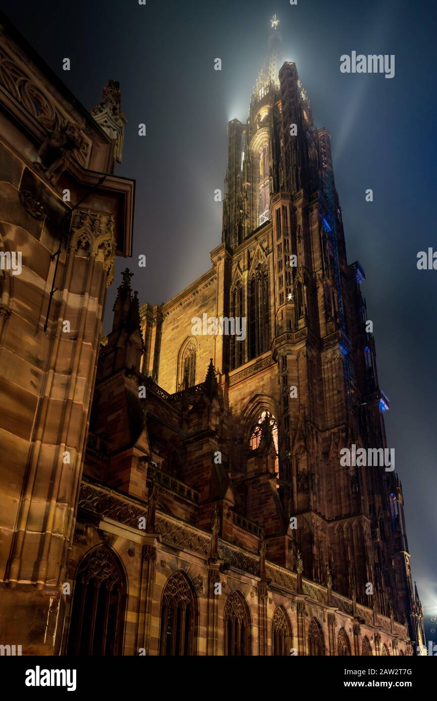 Stunning bottom view of Strasbourg Cathedral illuminated at night ...