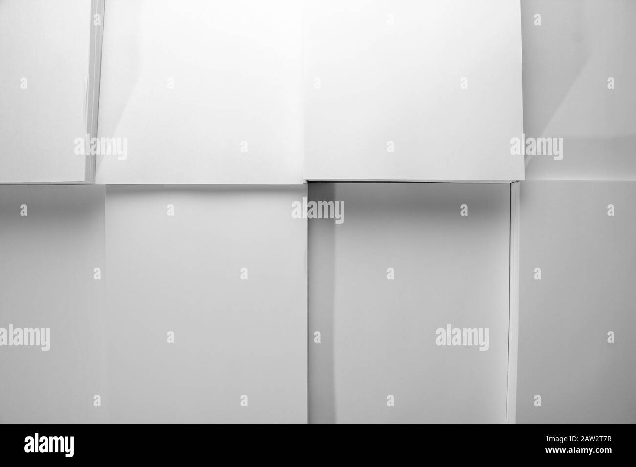 Several stacks of white paper on a white background Stock Photo - Alamy