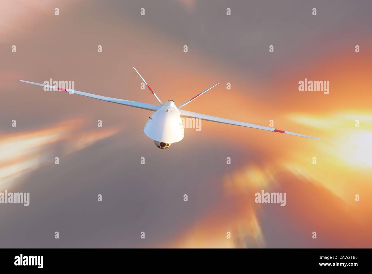 Unmanned military drone patrols high in the sky at sunset. The view is ...