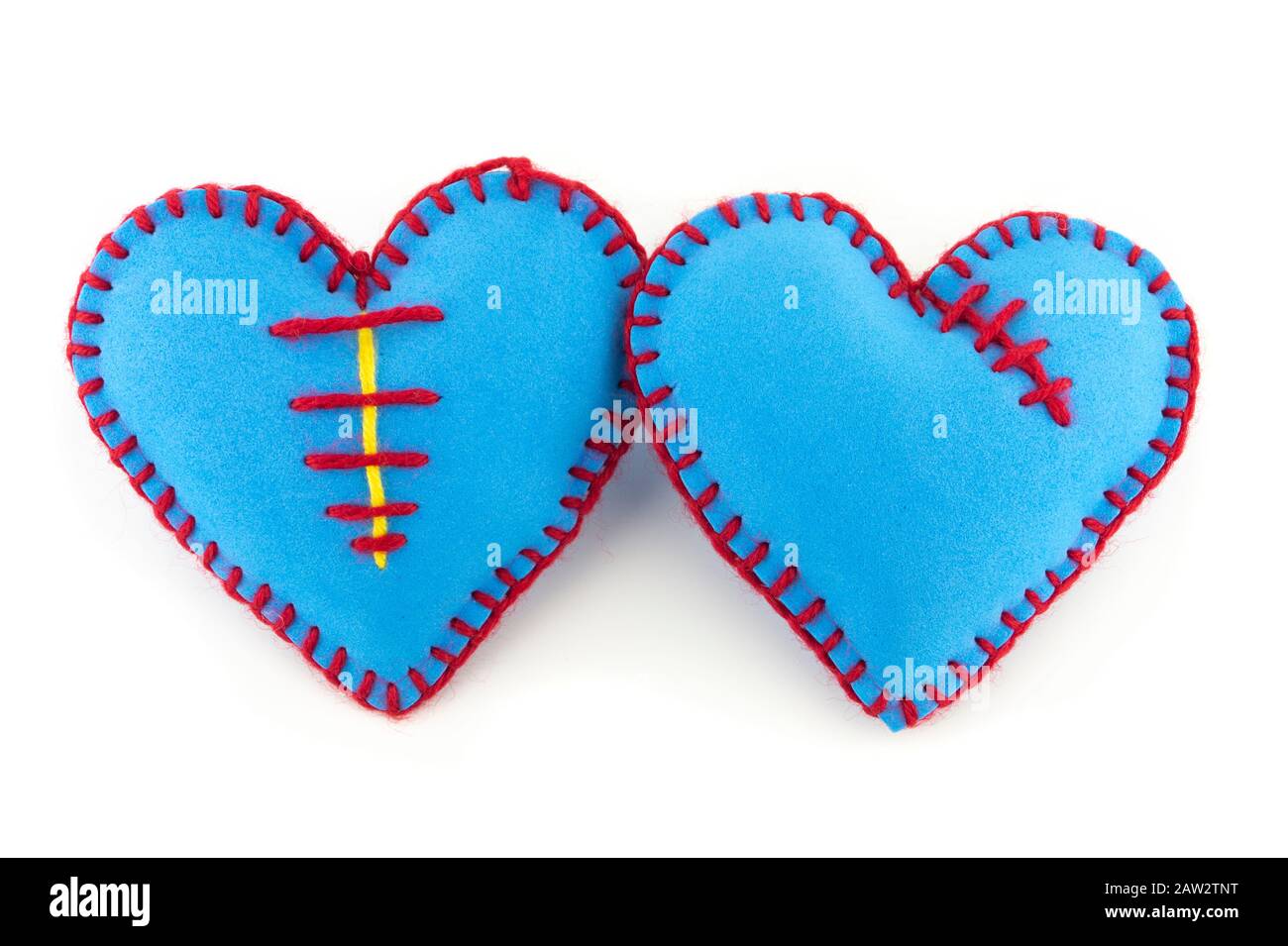 Hand stitched textile hearts isolated on white background for romantic ...