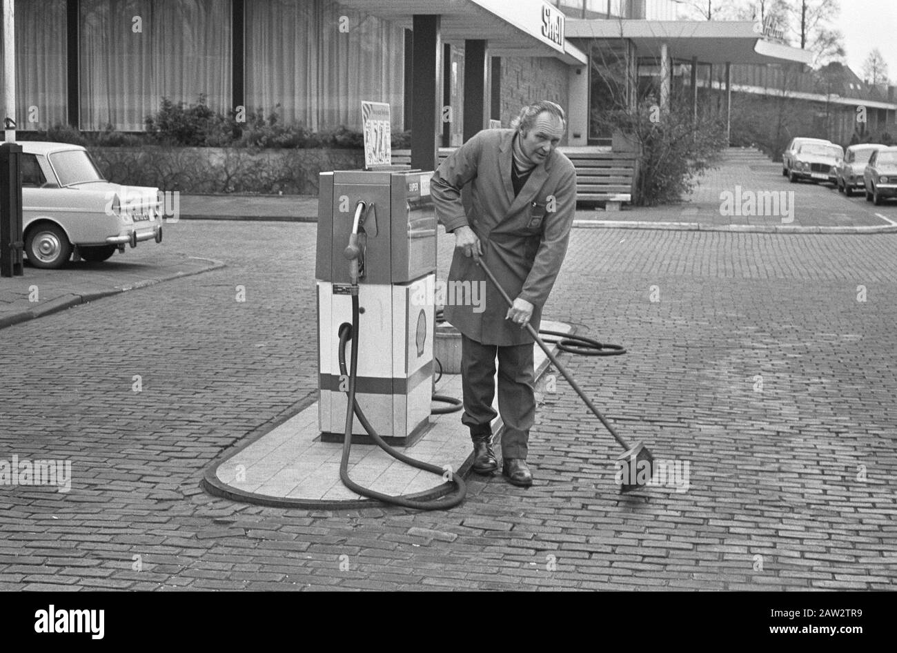 First day of gasoline distribution Pumping Station Attendant sweeps the ...
