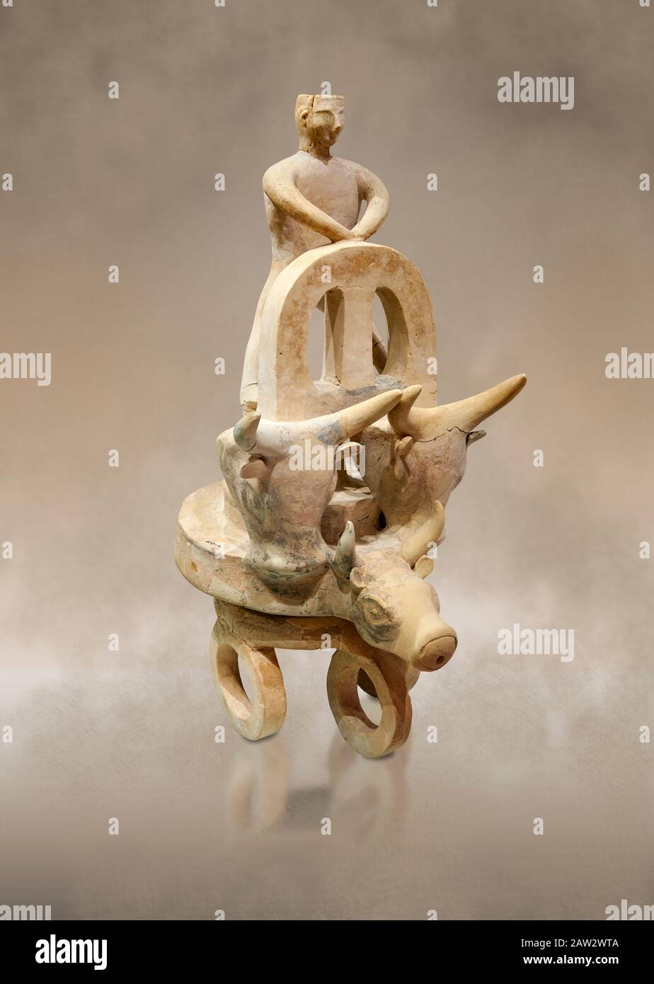 Minoan cult model of a 3 wheeled chariot drawn by a bull with a ...