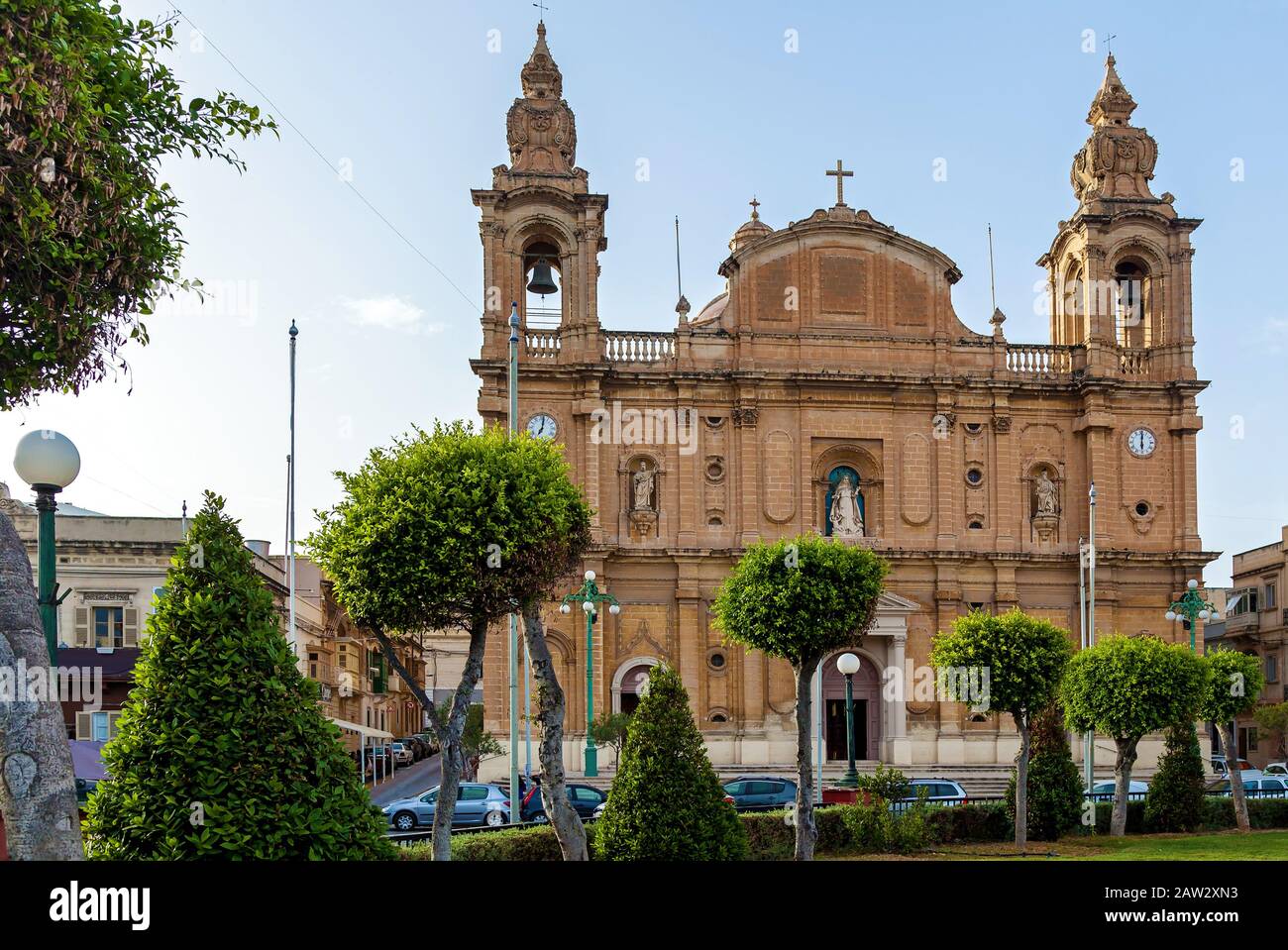 Beautiful view of the catholic baroque church on the background of blue ...