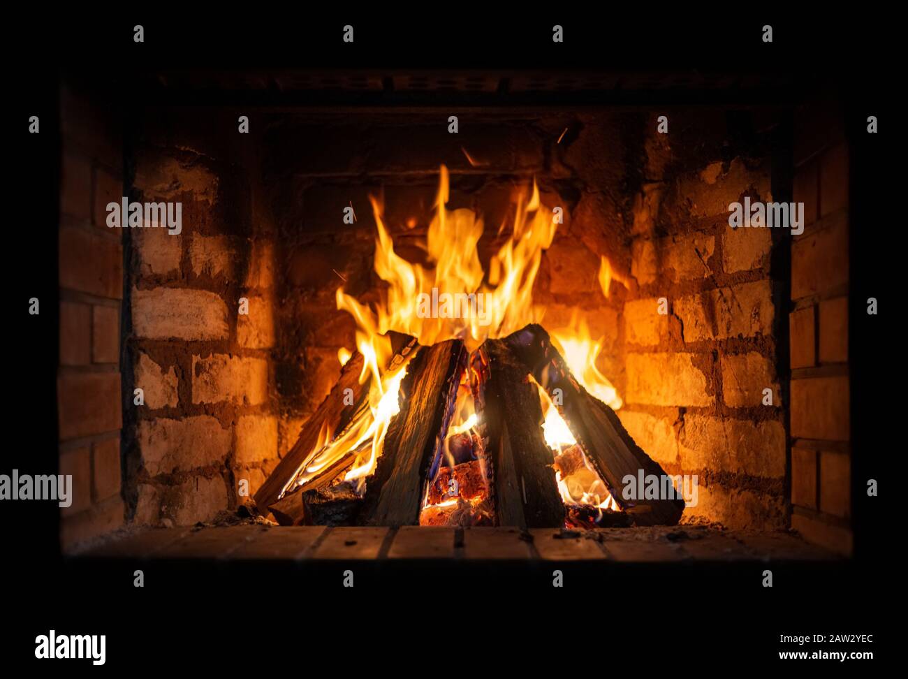 Fireplace. Firewood burning in a fireplace close-up Stock Photo - Alamy