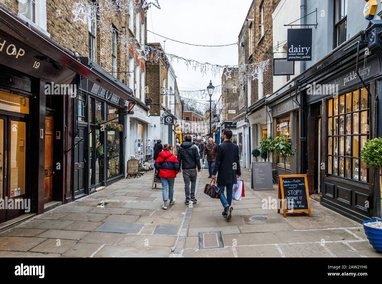 Shoppers browsing the antique shops and stalls in Camden Passage at The ...
