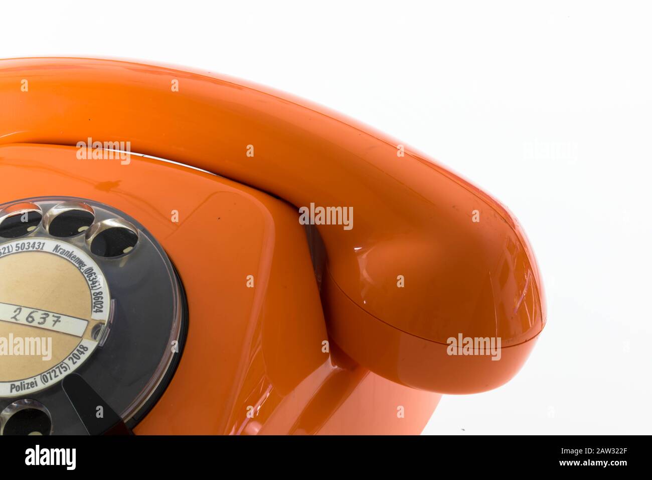 orange colored seventies retro telephone with dial Stock Photo - Alamy