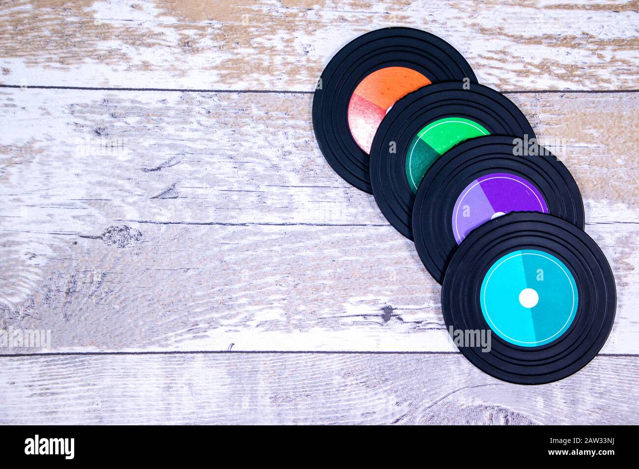 Four Retro classic type LP discs for playing music seen on a wood ...