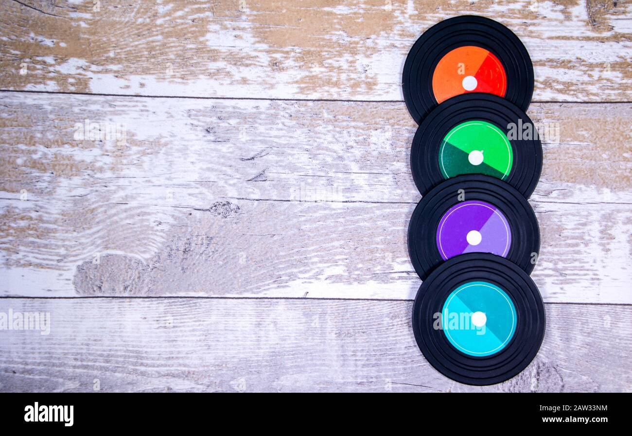 Four Retro classic type LP discs for playing music seen on a wood ...