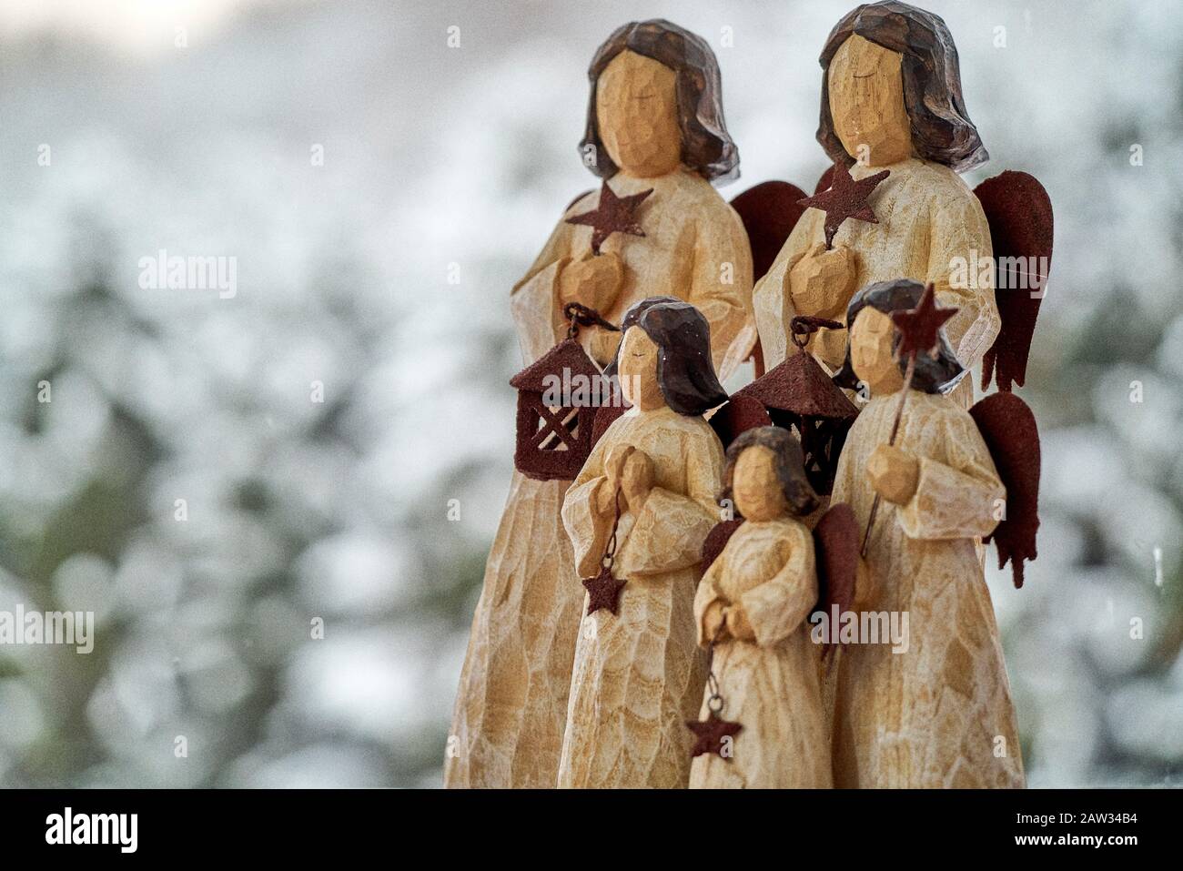 Wooden christmas angel family Stock Photo - Alamy