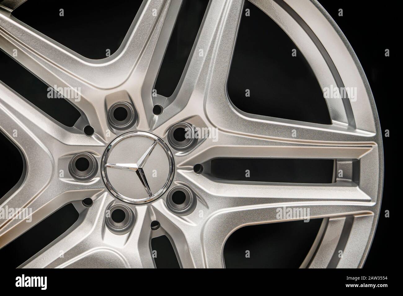 The Mercedes logo icon on the original cast disc. Close up. Native ...