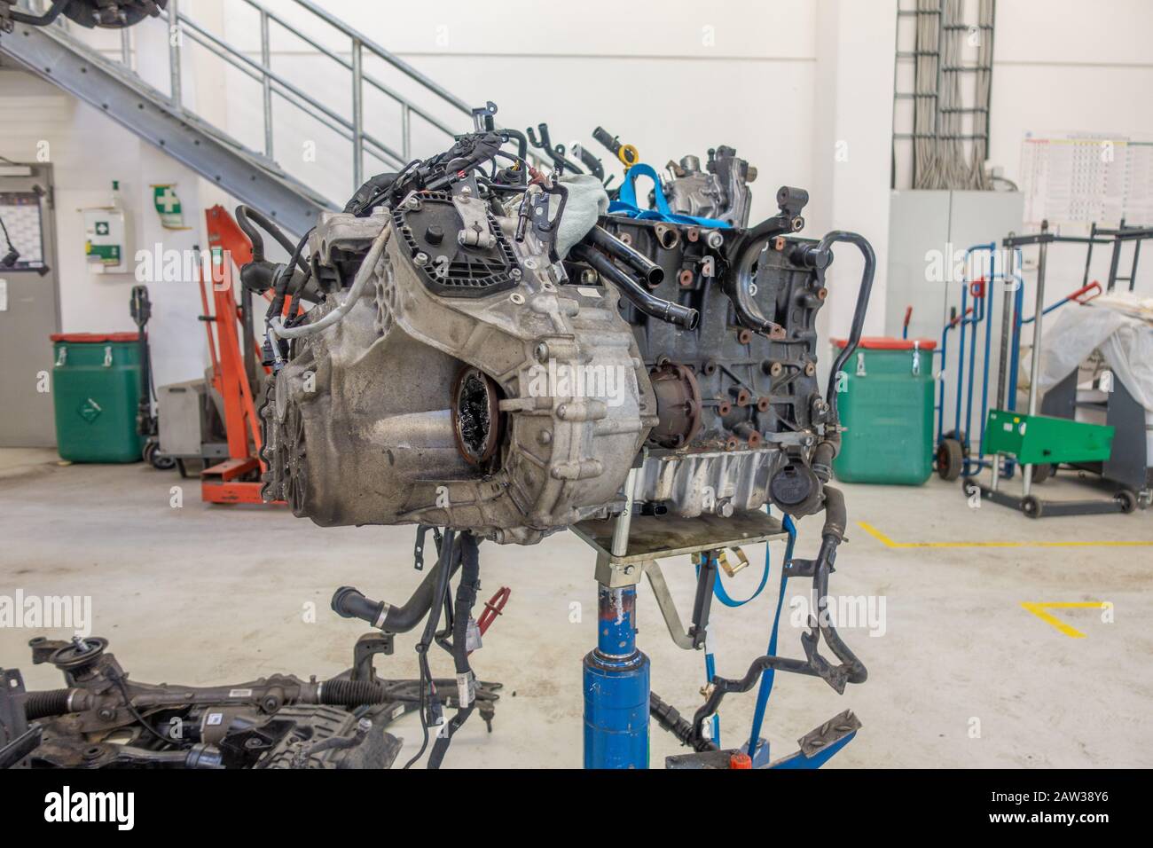 in a garage the engine of a car was removed to be repaired Stock Photo ...