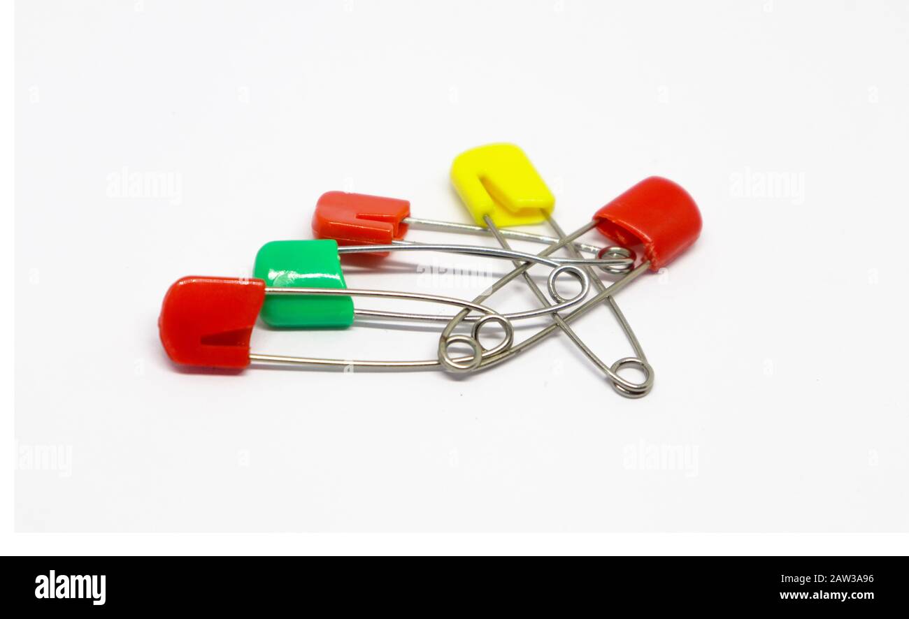 Colorful safety pin isolated on white background Stock Photo - Alamy