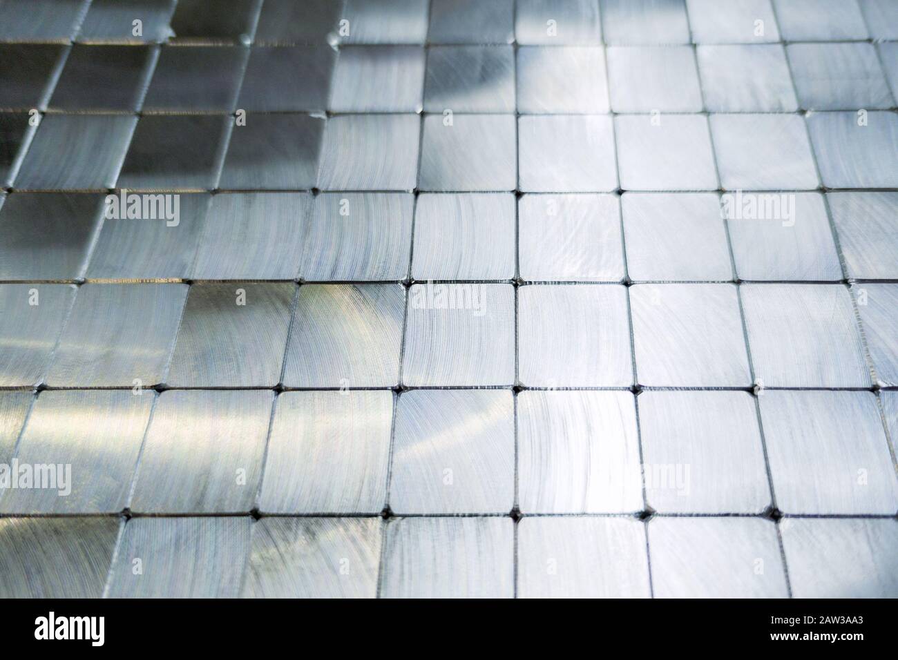 shiny steel machined blocks pavement surface background - close-up with ...
