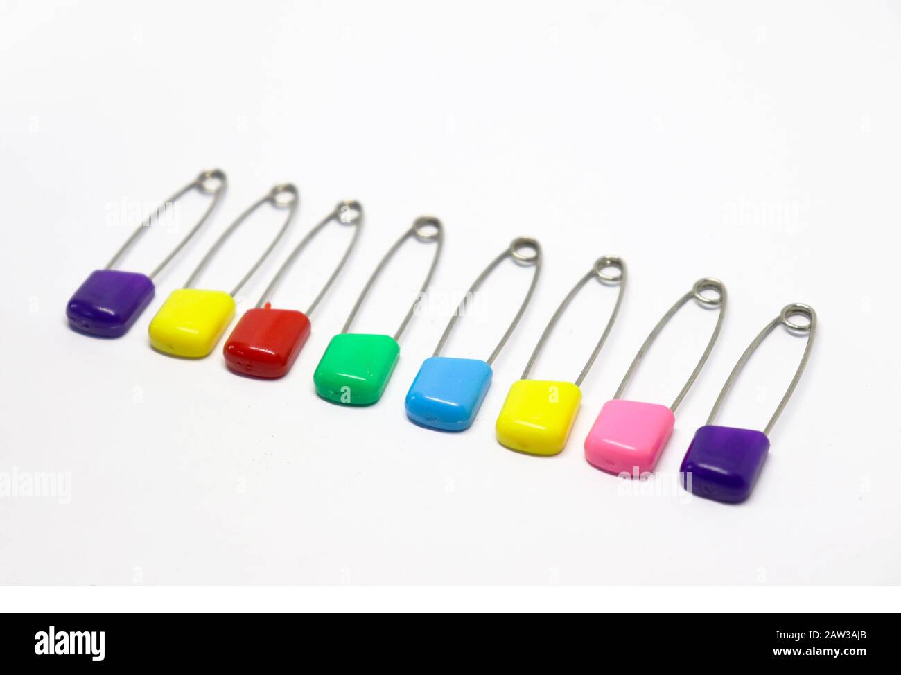 Colorful safety pin isolated on white background Stock Photo - Alamy