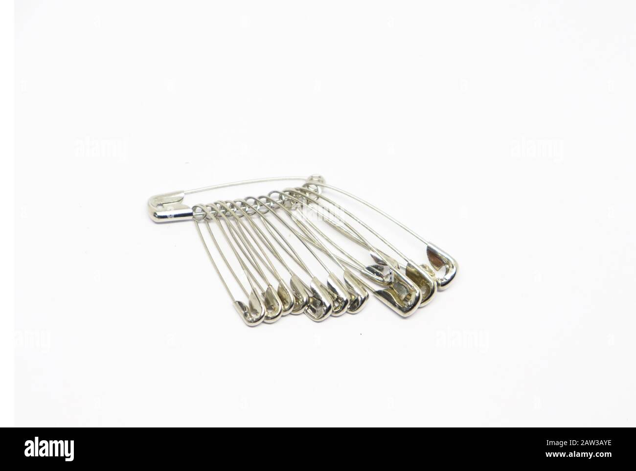 Steel safety pin isolated on white background Stock Photo - Alamy