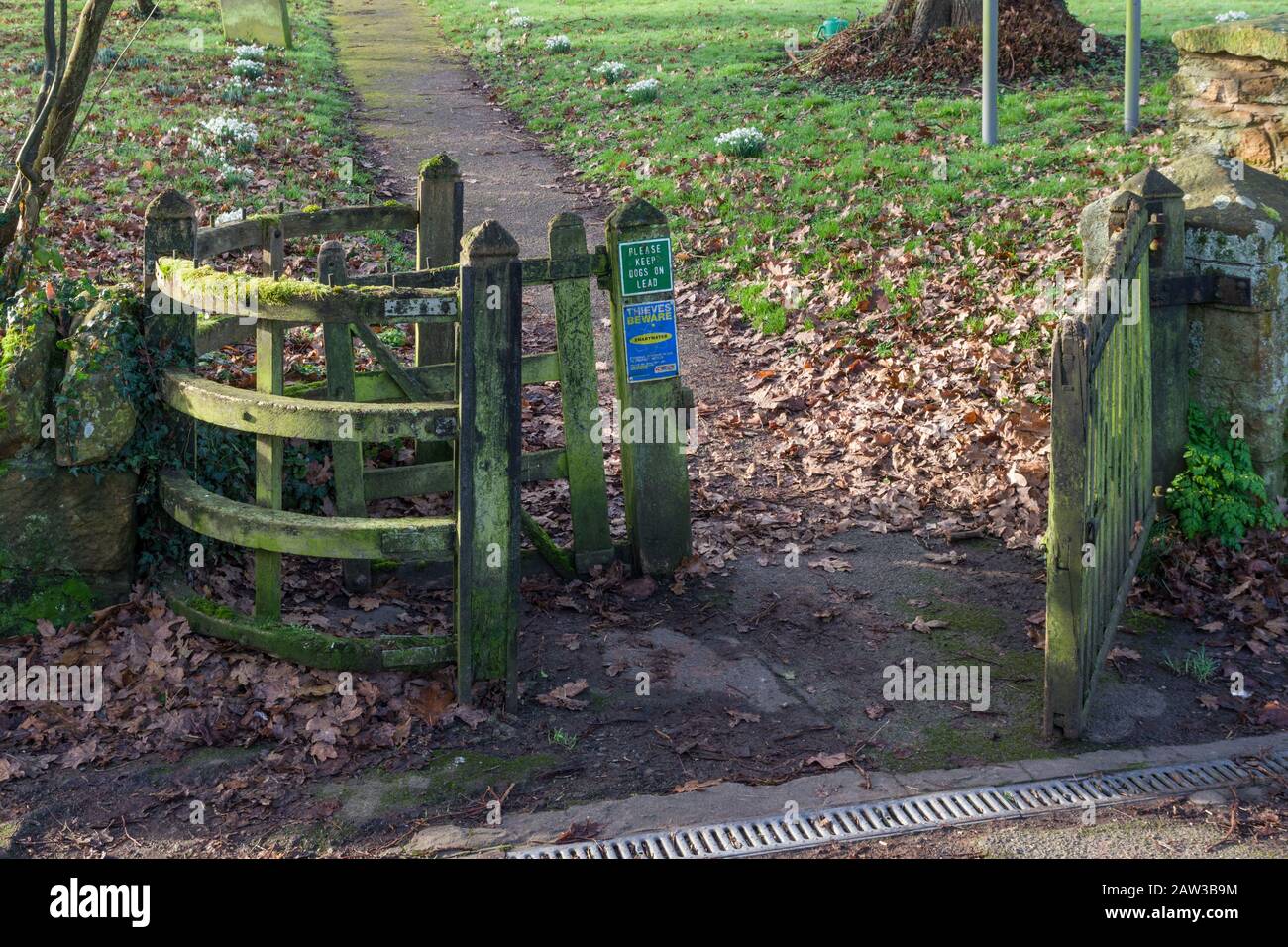 Weathered wooden gates at the entrance to the church of St Michael and ...