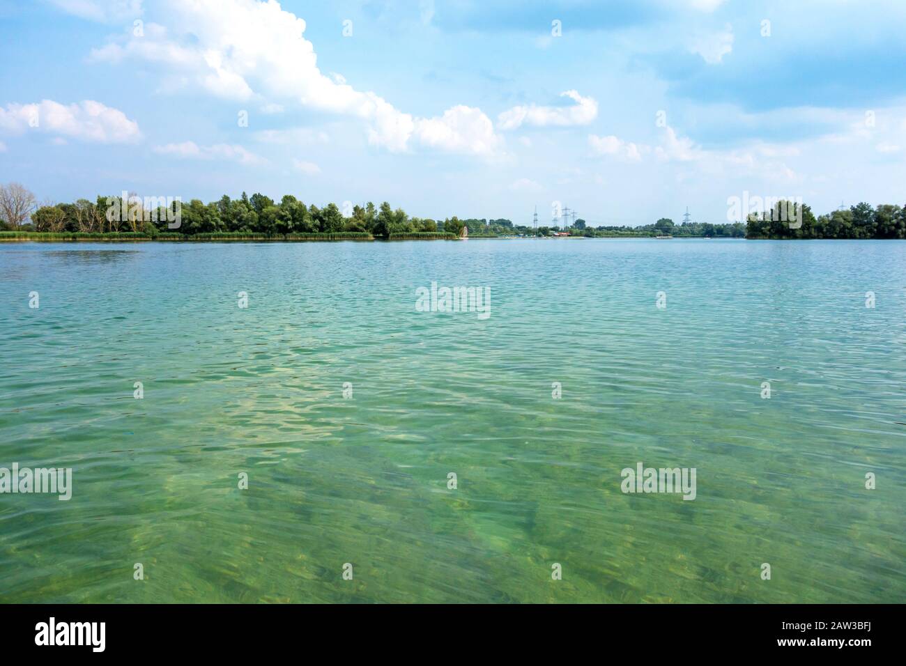 idyllic water landscape, lake with trees around Stock Photo - Alamy