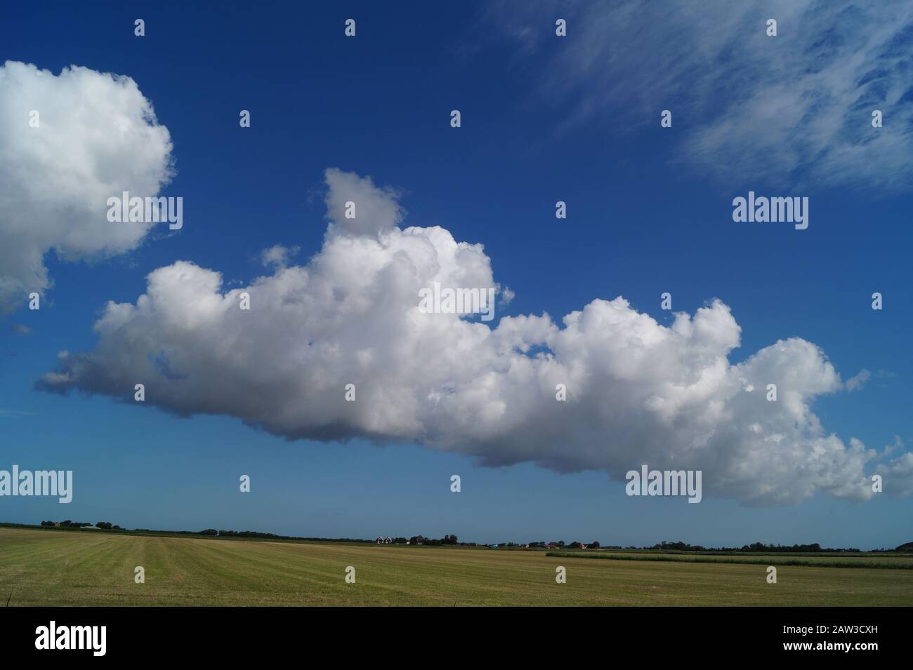 Big clouds over fields in Texel Stock Photo - Alamy