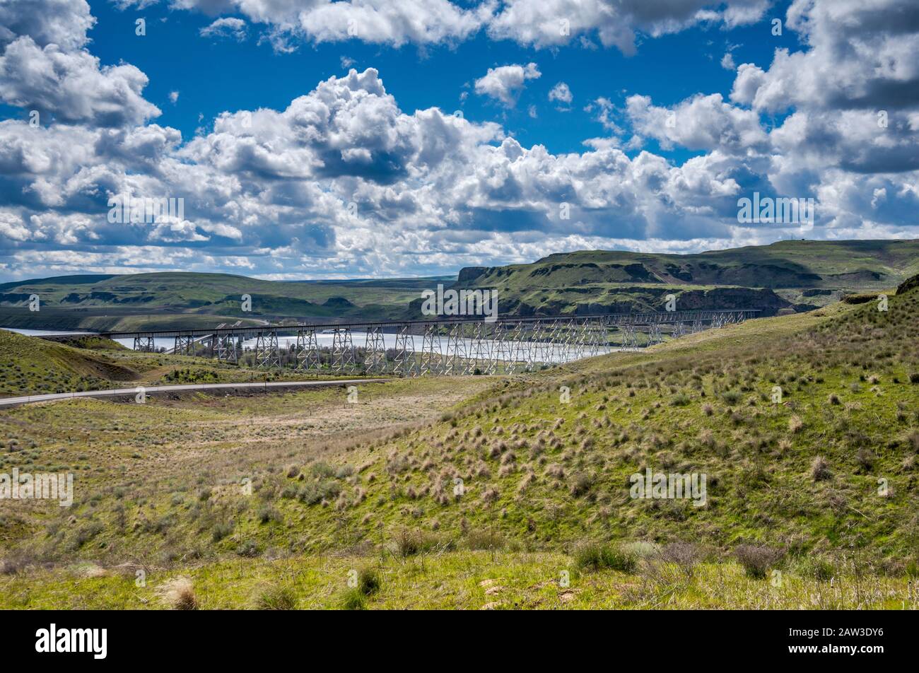 Clouds over railway steel trestle bridge across Lake West at confluence ...