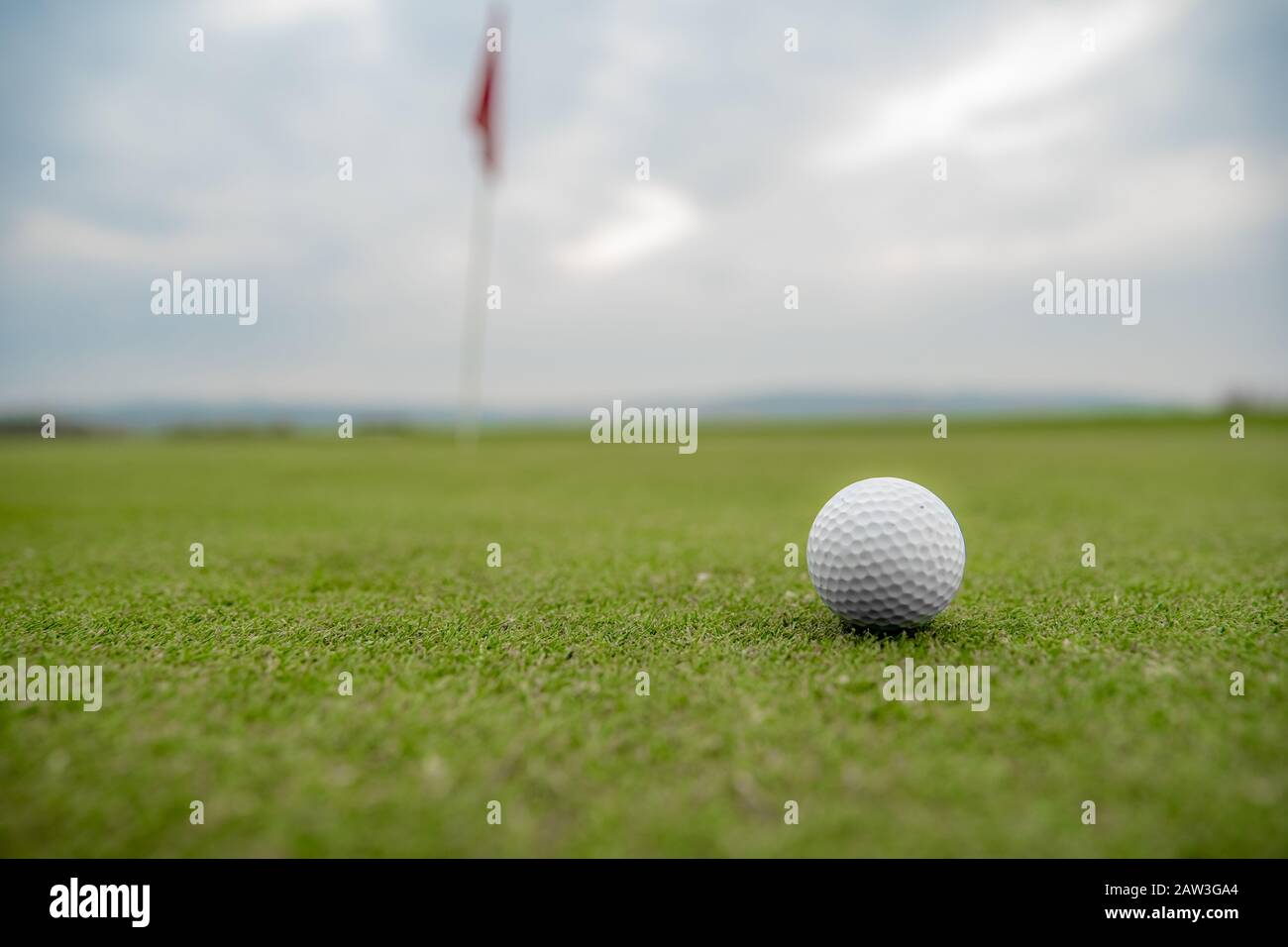 golf ball on the golf course before hitting the pit Stock Photo - Alamy