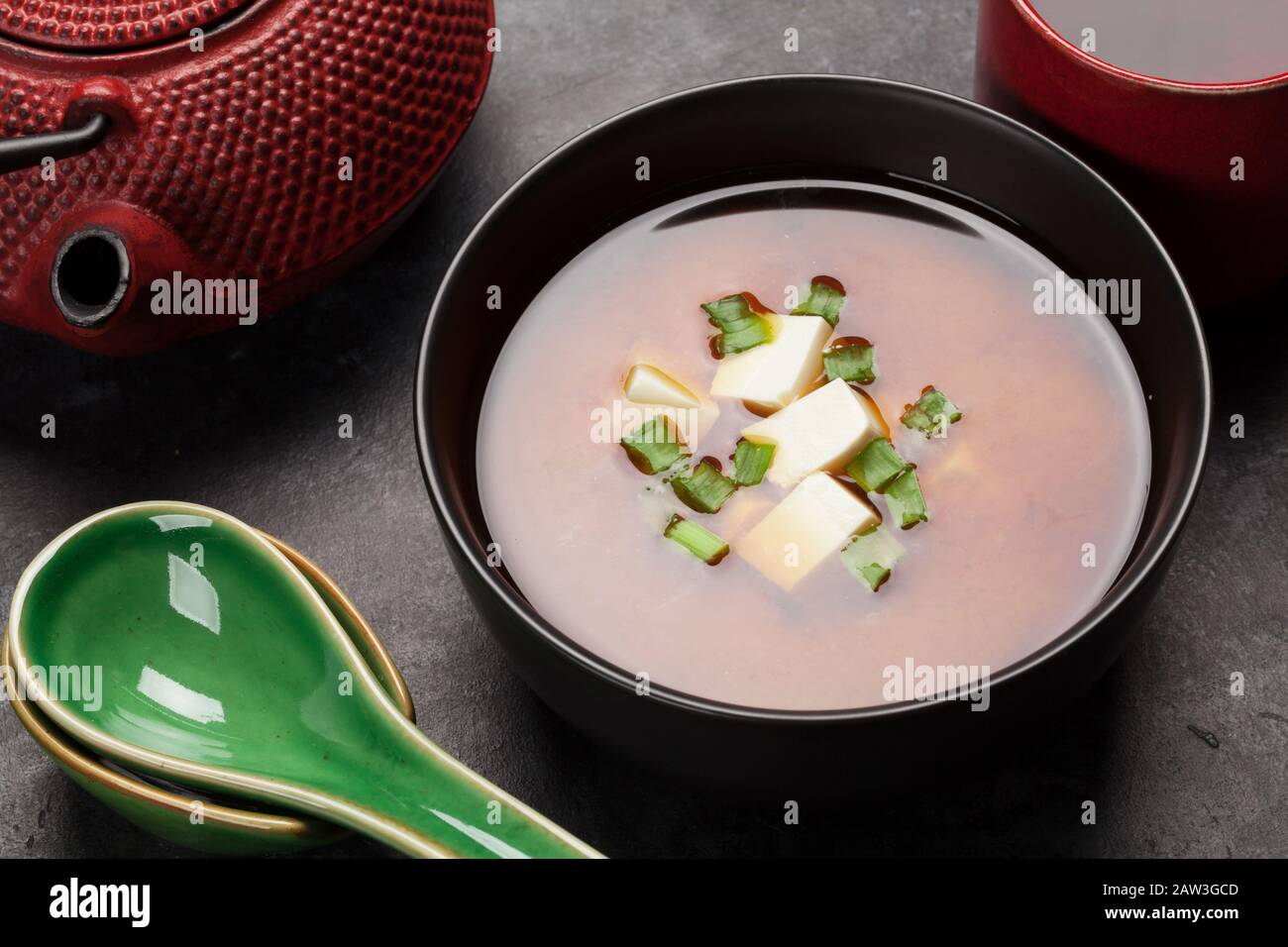 Miso traditional Japanese soup with tofu and spring onion. With green ...