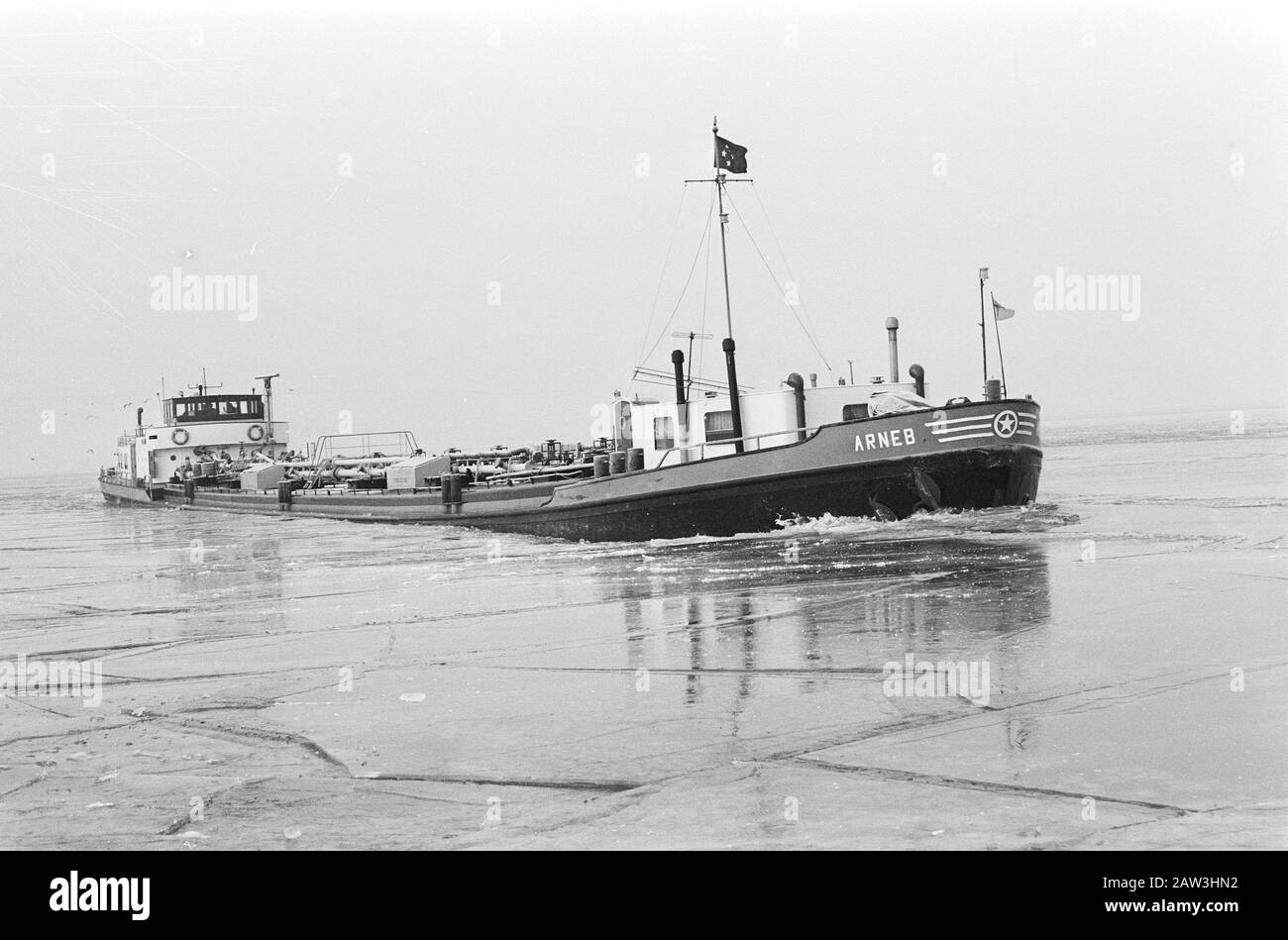 Convoy Ships with icebreakers on the IJsselmeer; tanker in ice Date ...