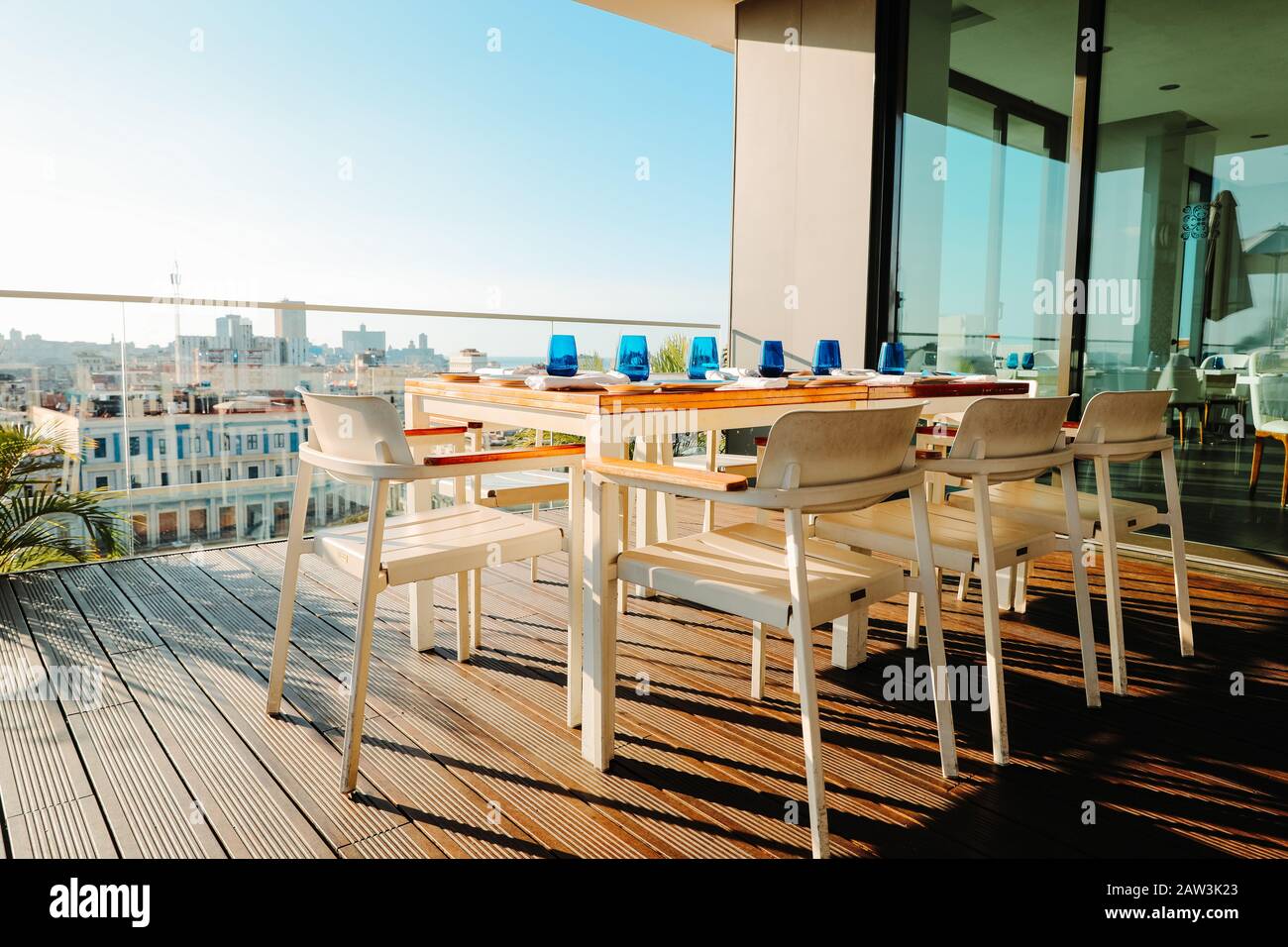 Dining table on a rooftop Stock Photo - Alamy