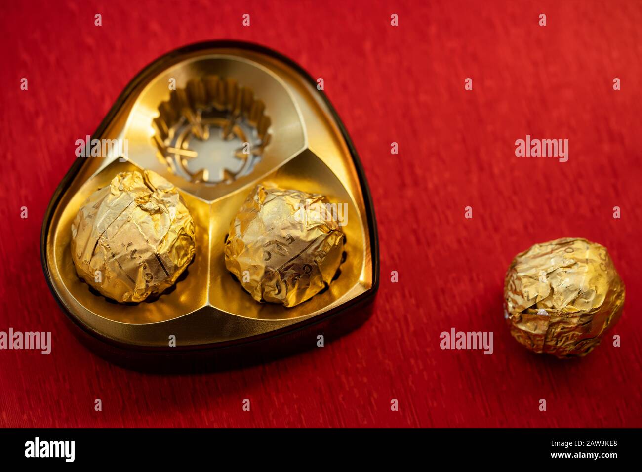 Luxury chocolate box containing golden paper wrapped chocolates for ...