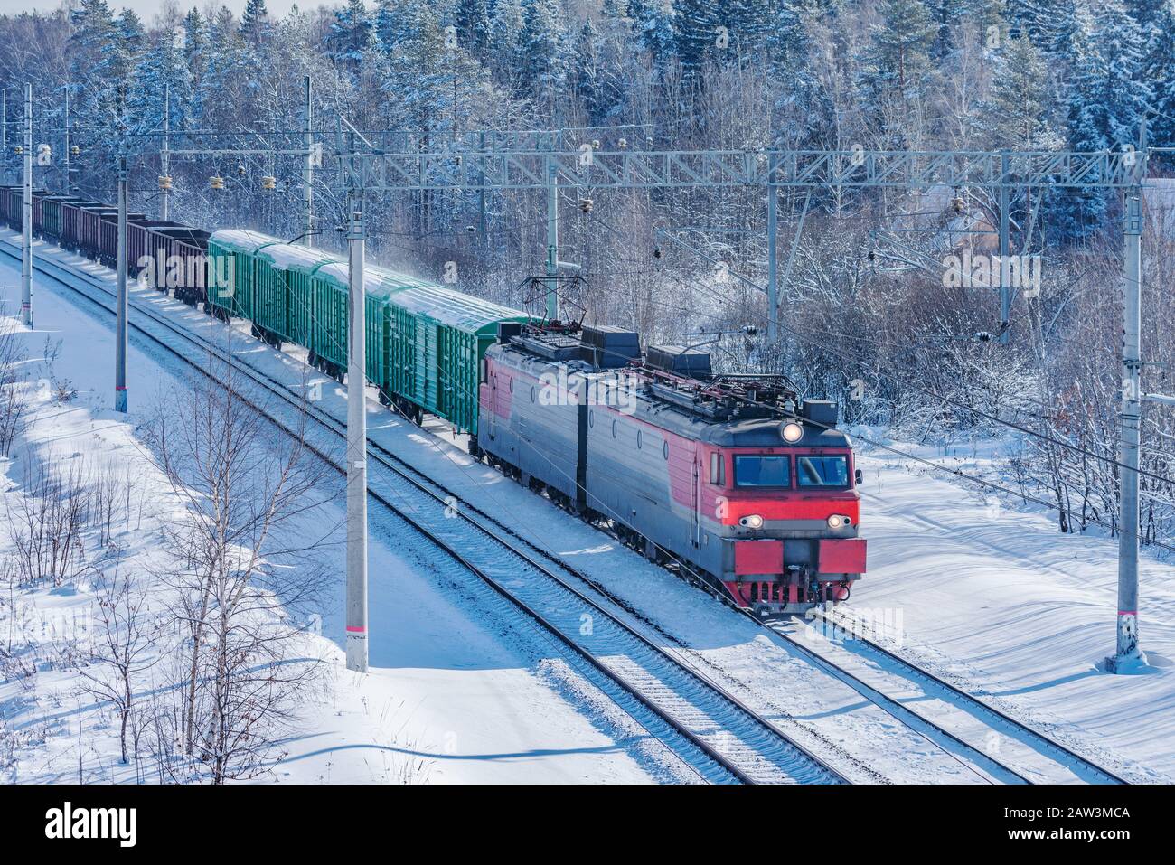 Freight train moves at sunny winter day time Stock Photo - Alamy