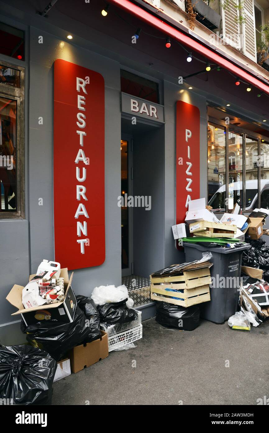 Garbage cans on the sidewalk in Paris - france Stock Photo - Alamy