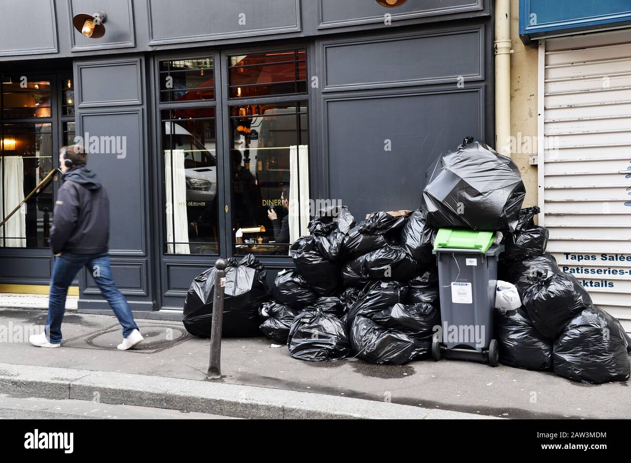 Garbage cans on the sidewalk in Paris - france Stock Photo - Alamy
