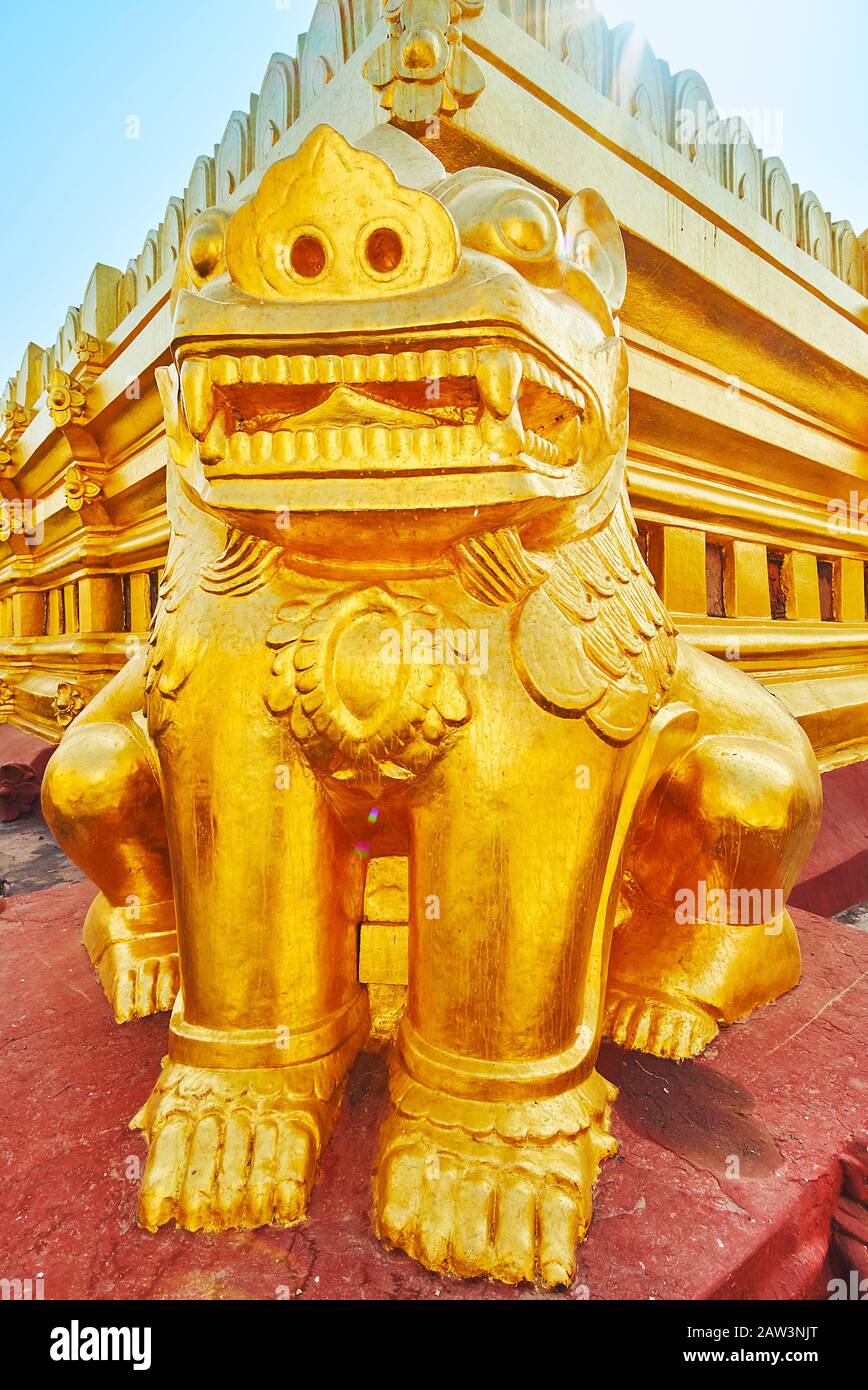 The statue of double-bodied golden Chinthe lion, guarding the main ...