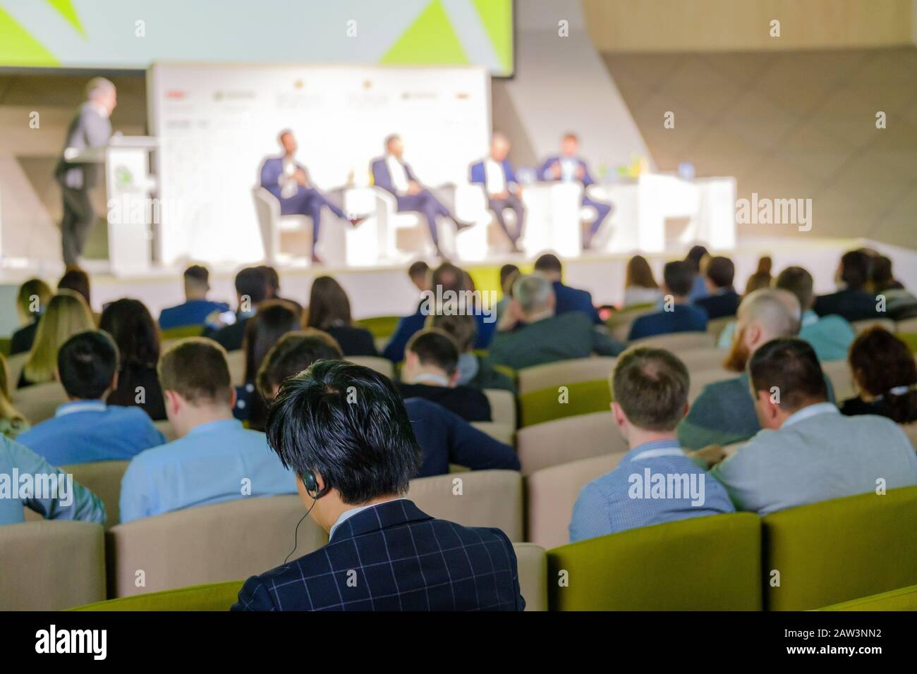 Business conference attendees sit and listen Stock Photo - Alamy