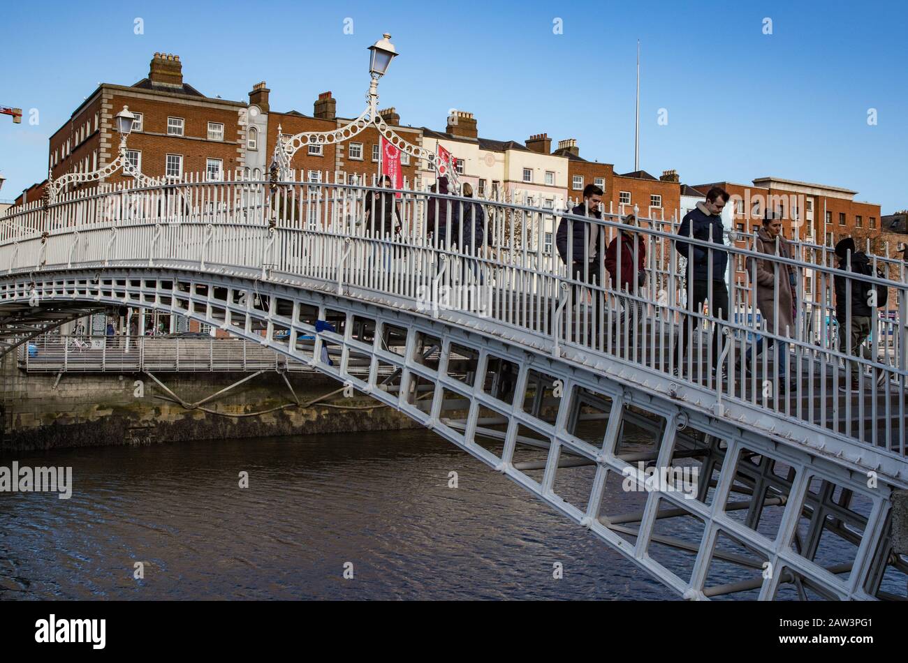 Dublin, Ireland - 29th January 2020: People crossing Ha'penny Bridge in ...