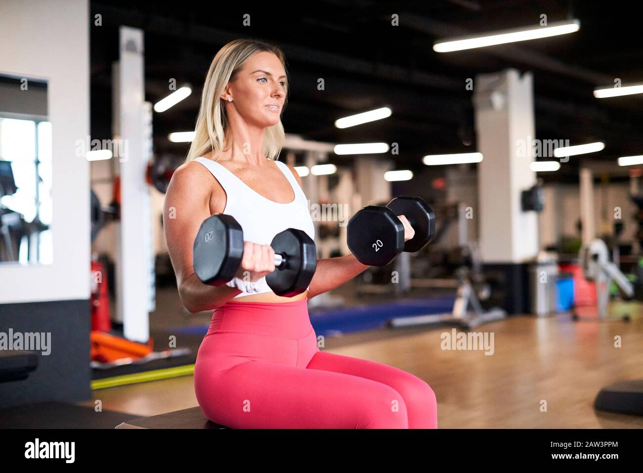 Woman lifting weights hi-res stock photography and images - Alamy