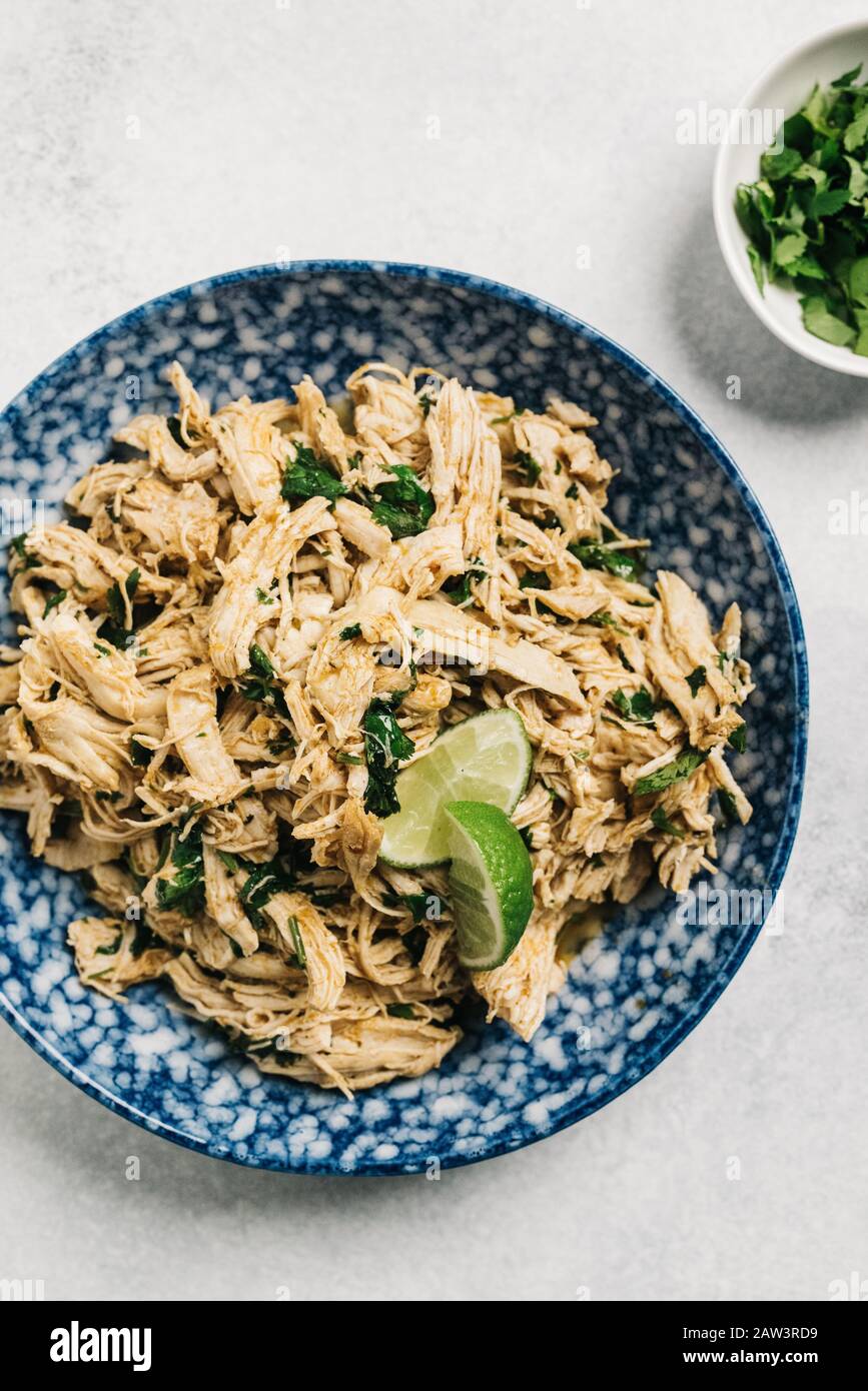 Cilantro lime shredded chicken meat Stock Photo - Alamy