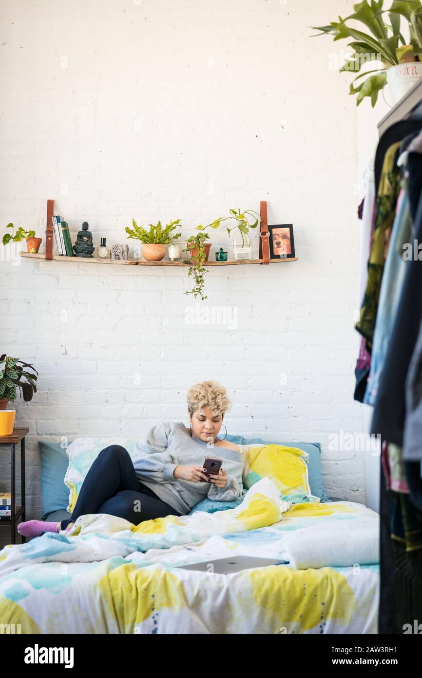 Female leaning against bedroom wall hi-res stock photography and images ...