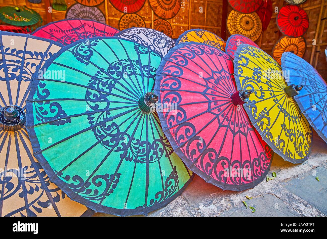 The close-up of summer Burmese umbrellas, made of paper and decorated ...