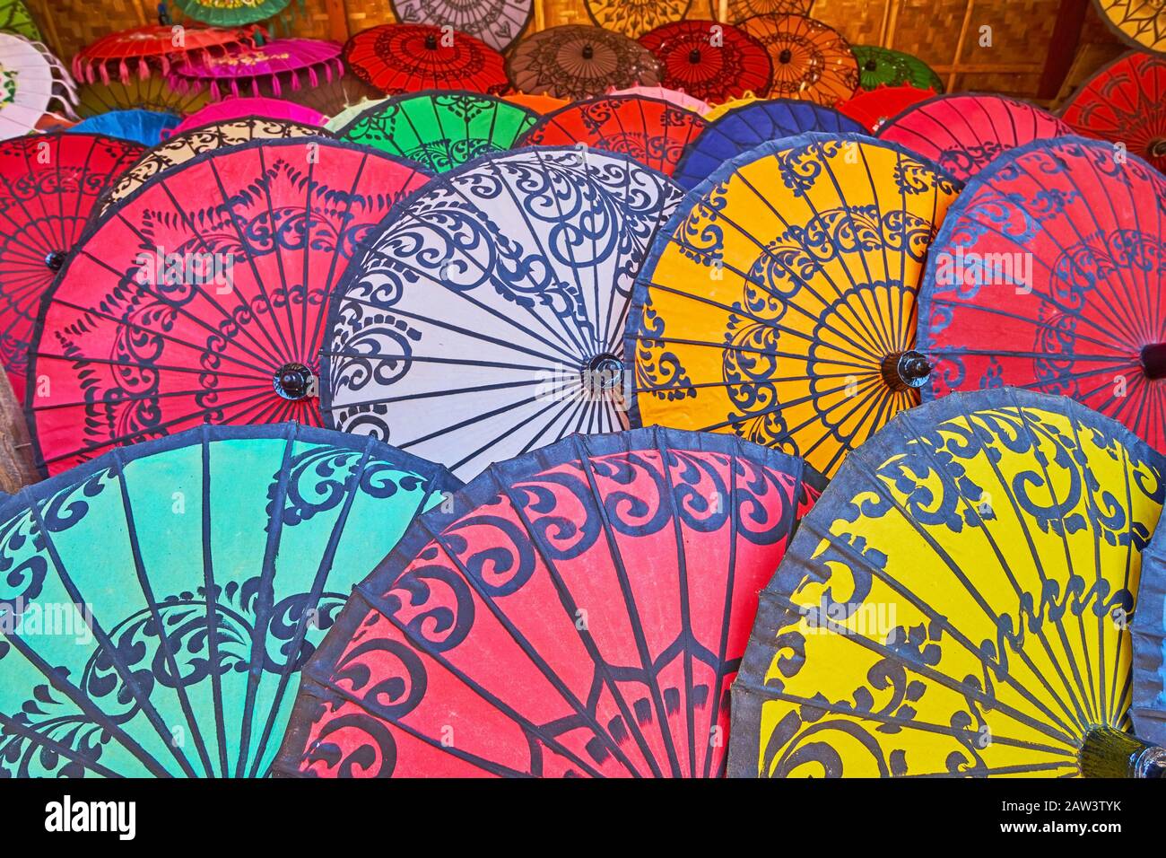 The bright colors and scenic floral patterns of handmade Burmese ...