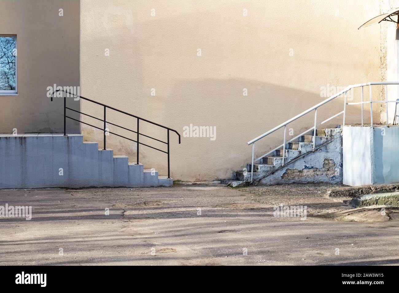 Two stairs against the wall of building Stock Photo - Alamy