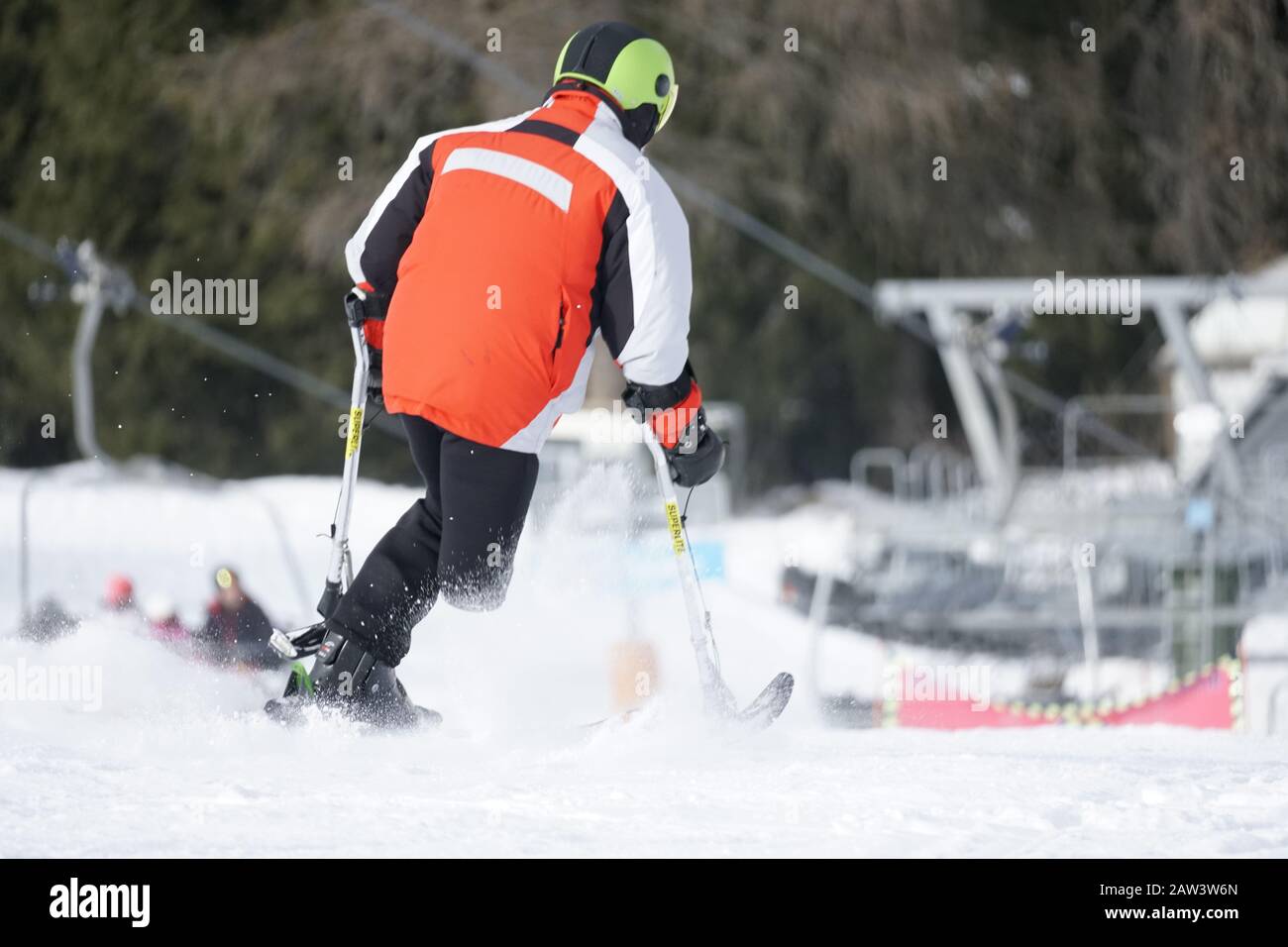 Disabled one leg senior man downhill skiing in Italy in the winter of ...