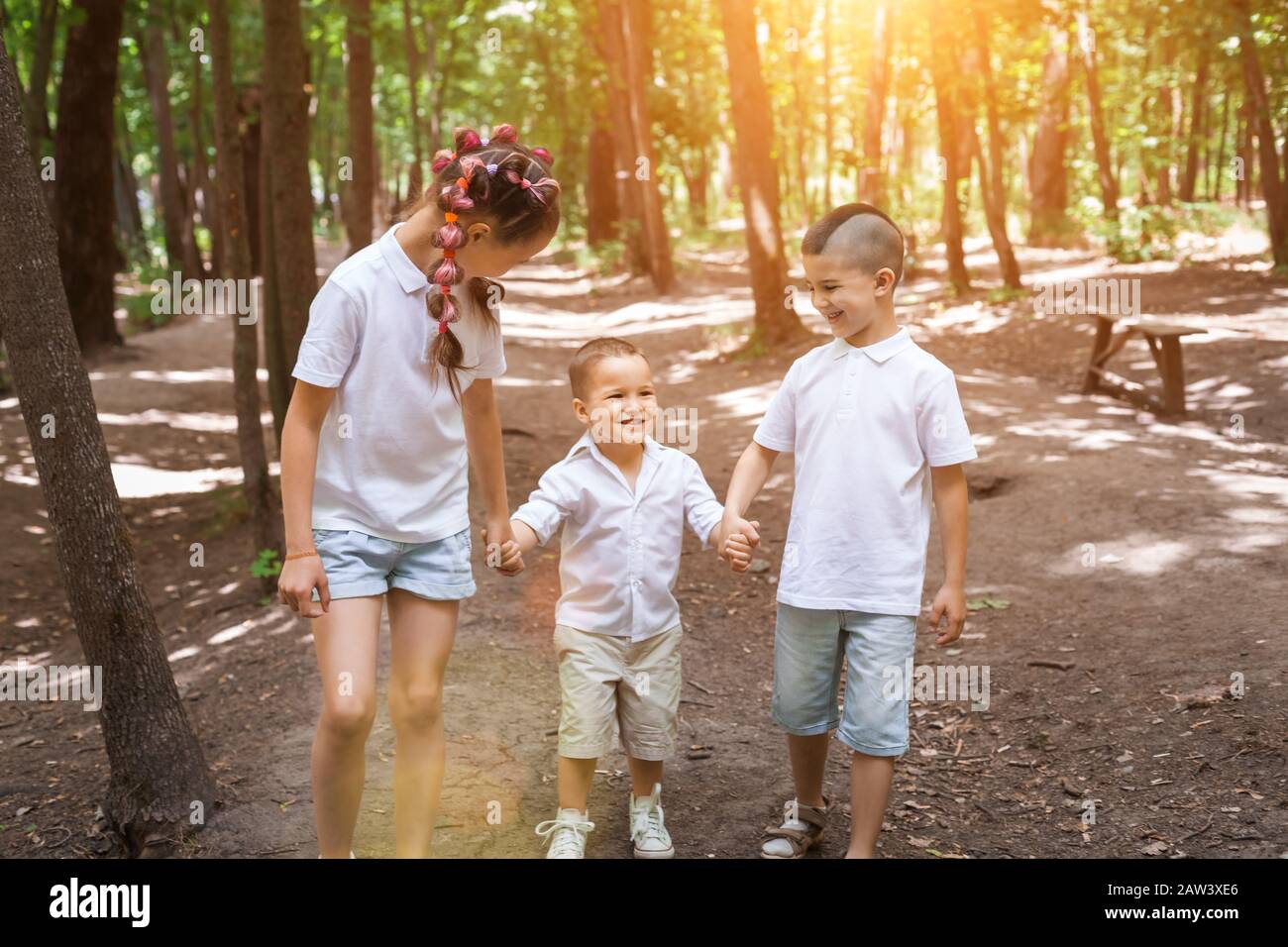 kids walking in the forest Stock Photo - Alamy