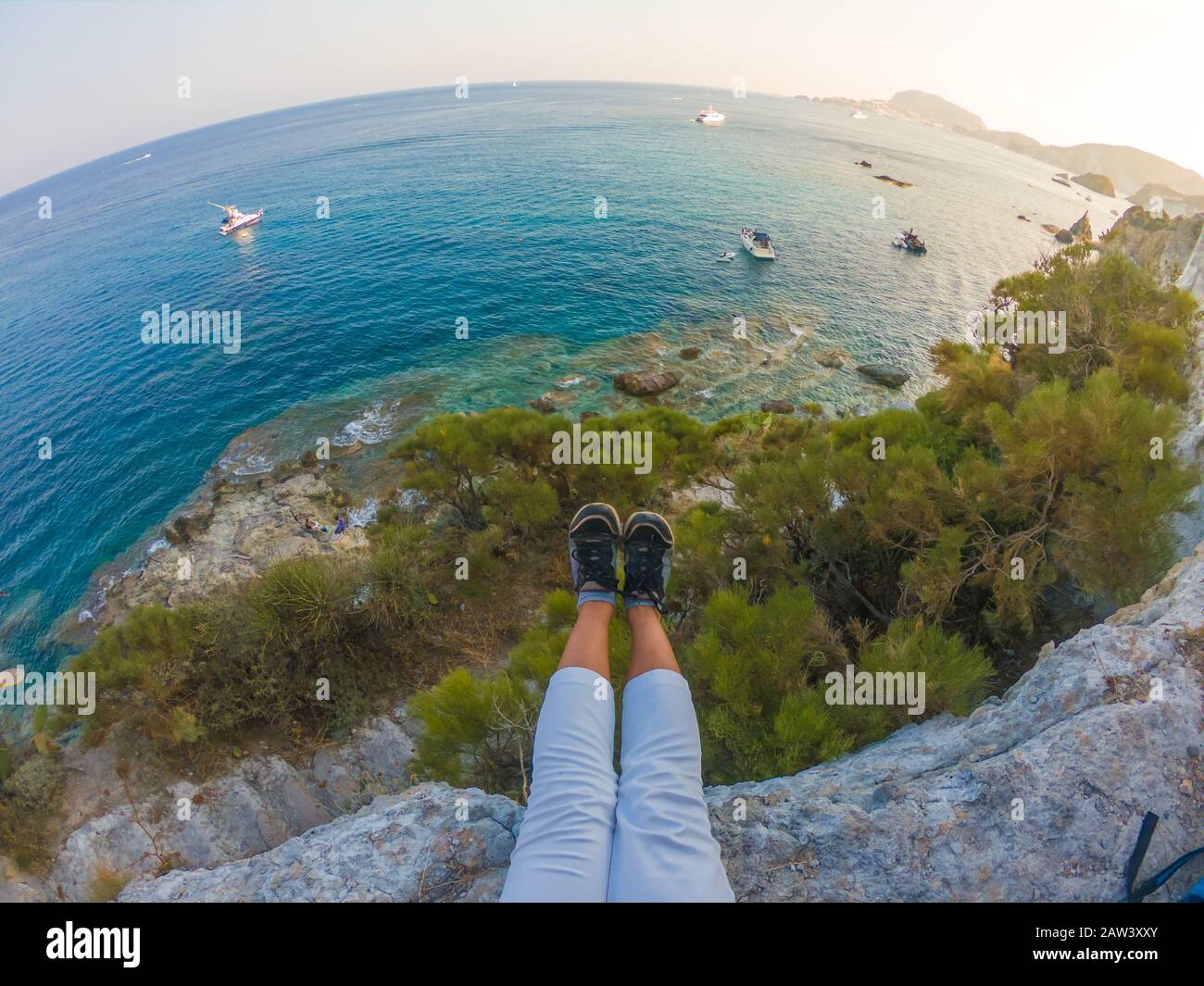 Girl Sitting On Edge Cliff High Resolution Stock Photography and Images ...